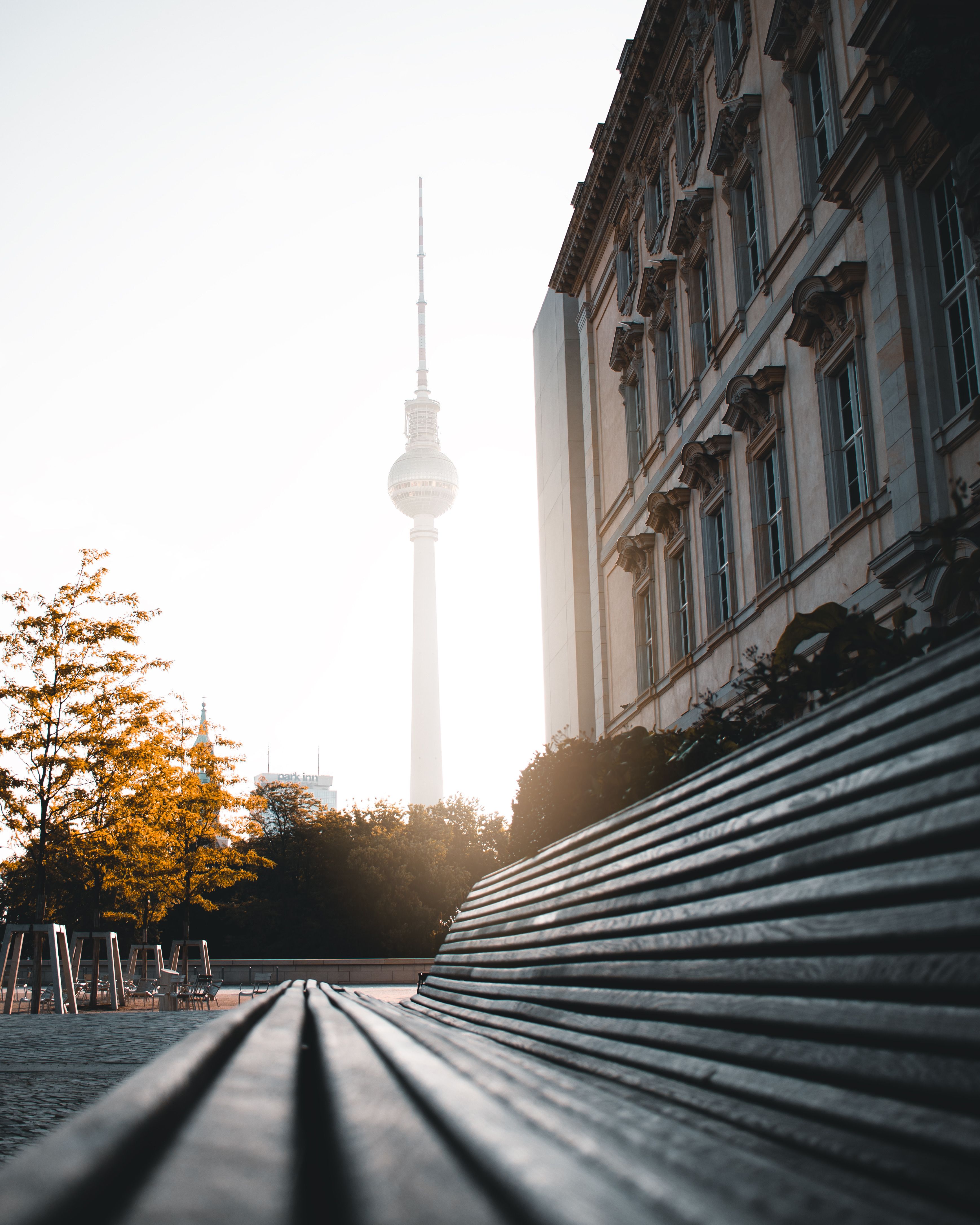 Sunlight over Broadcast Tower behind Bench · Free Stock Photo