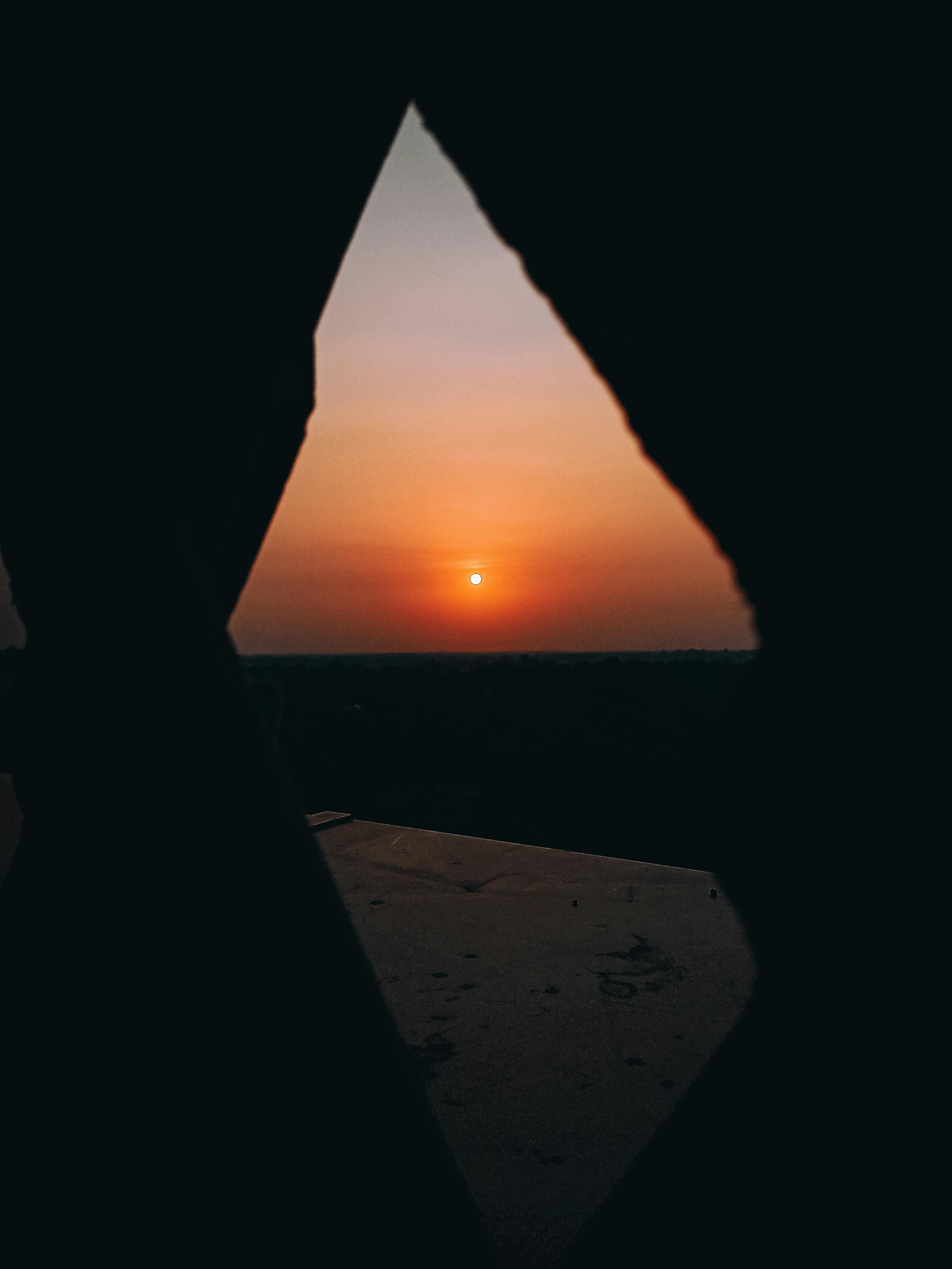 Sunset on Sky behind Rocks on Shore · Free Stock Photo