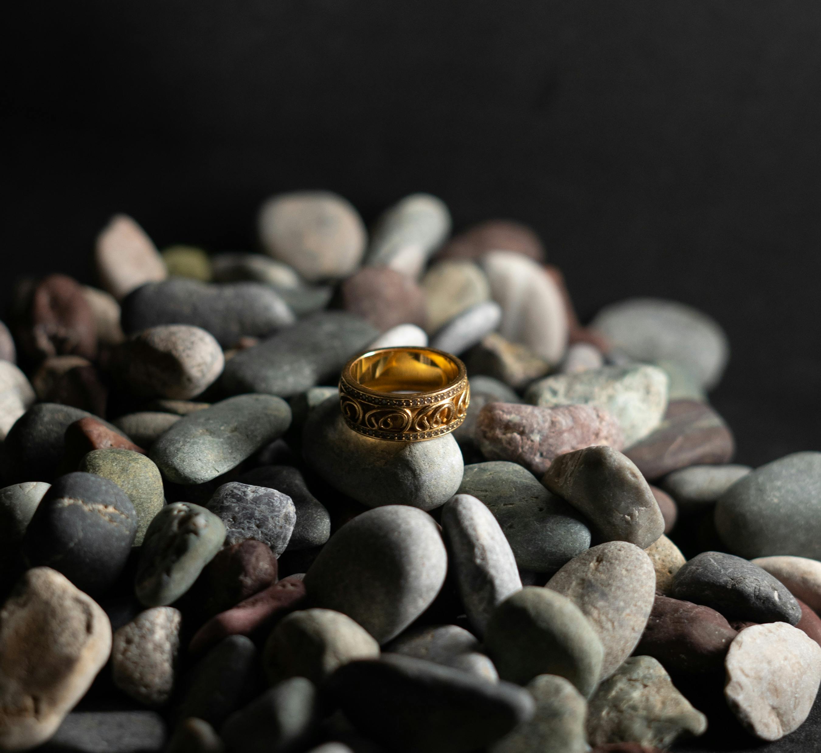 Gold Ring Displayed on Stones · Free Stock Photo