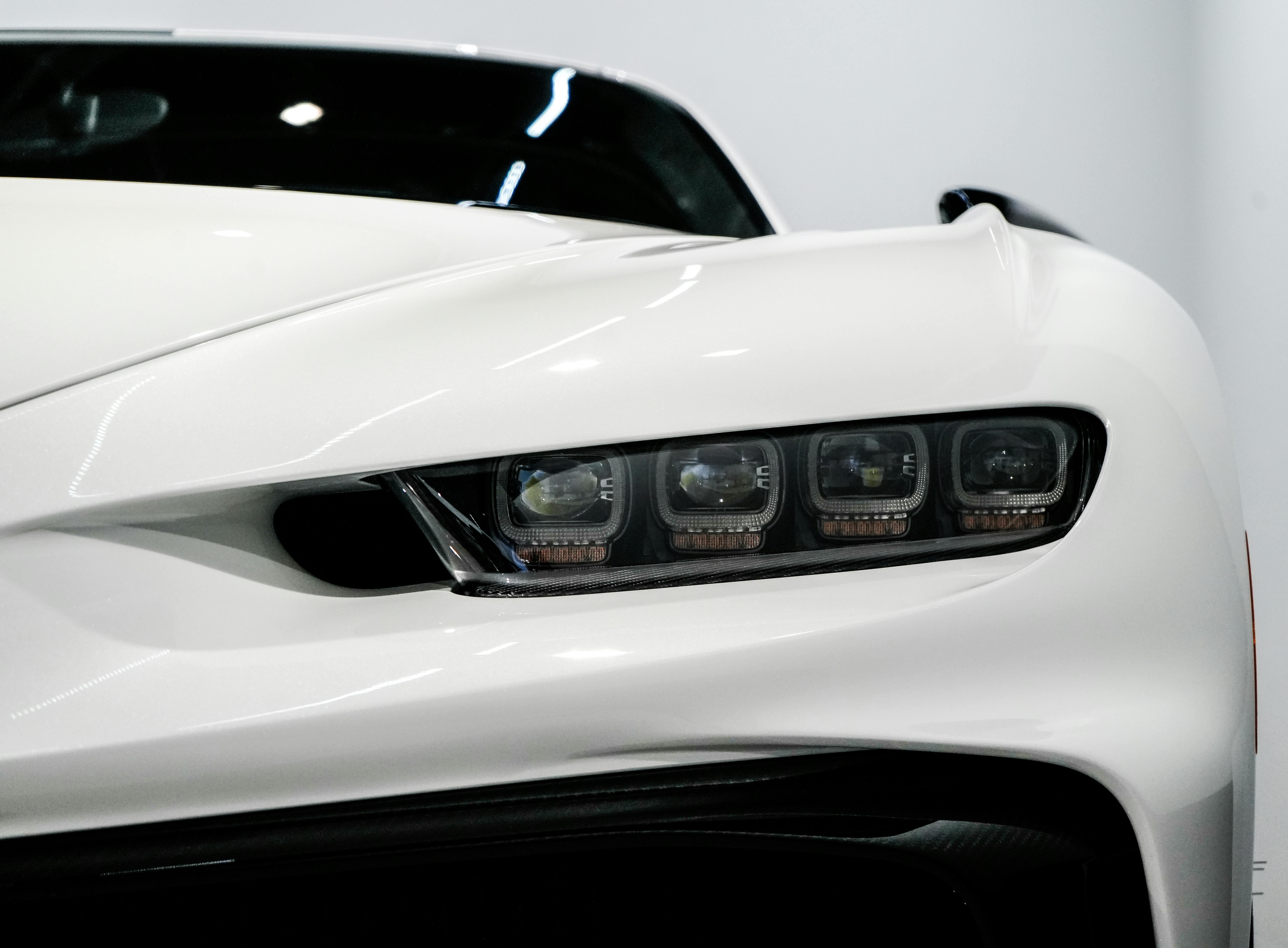 Headlight and Hood of a Modern Sports Car · Free Stock Photo