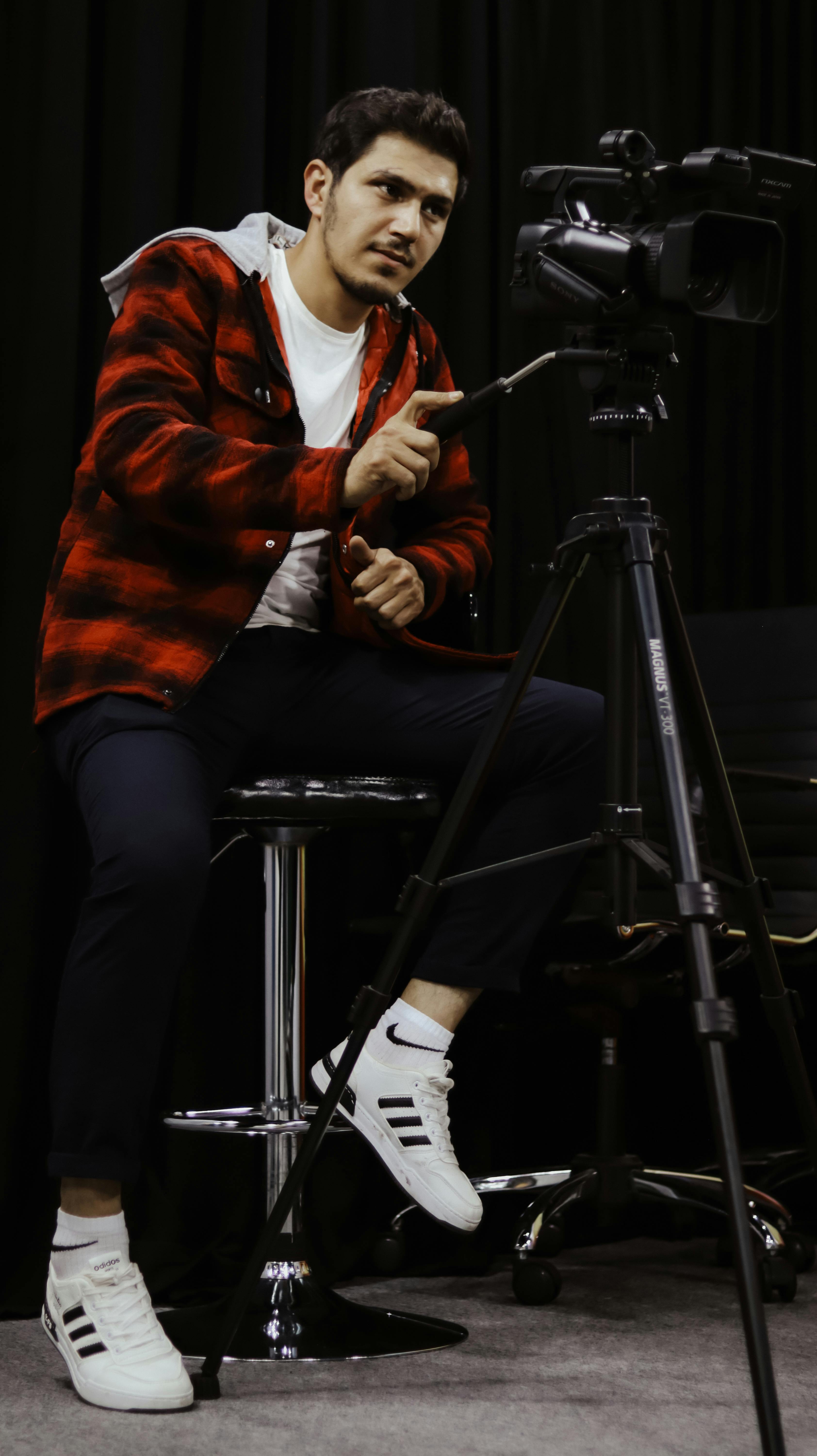 Young Man Operating a Camera · Free Stock Photo