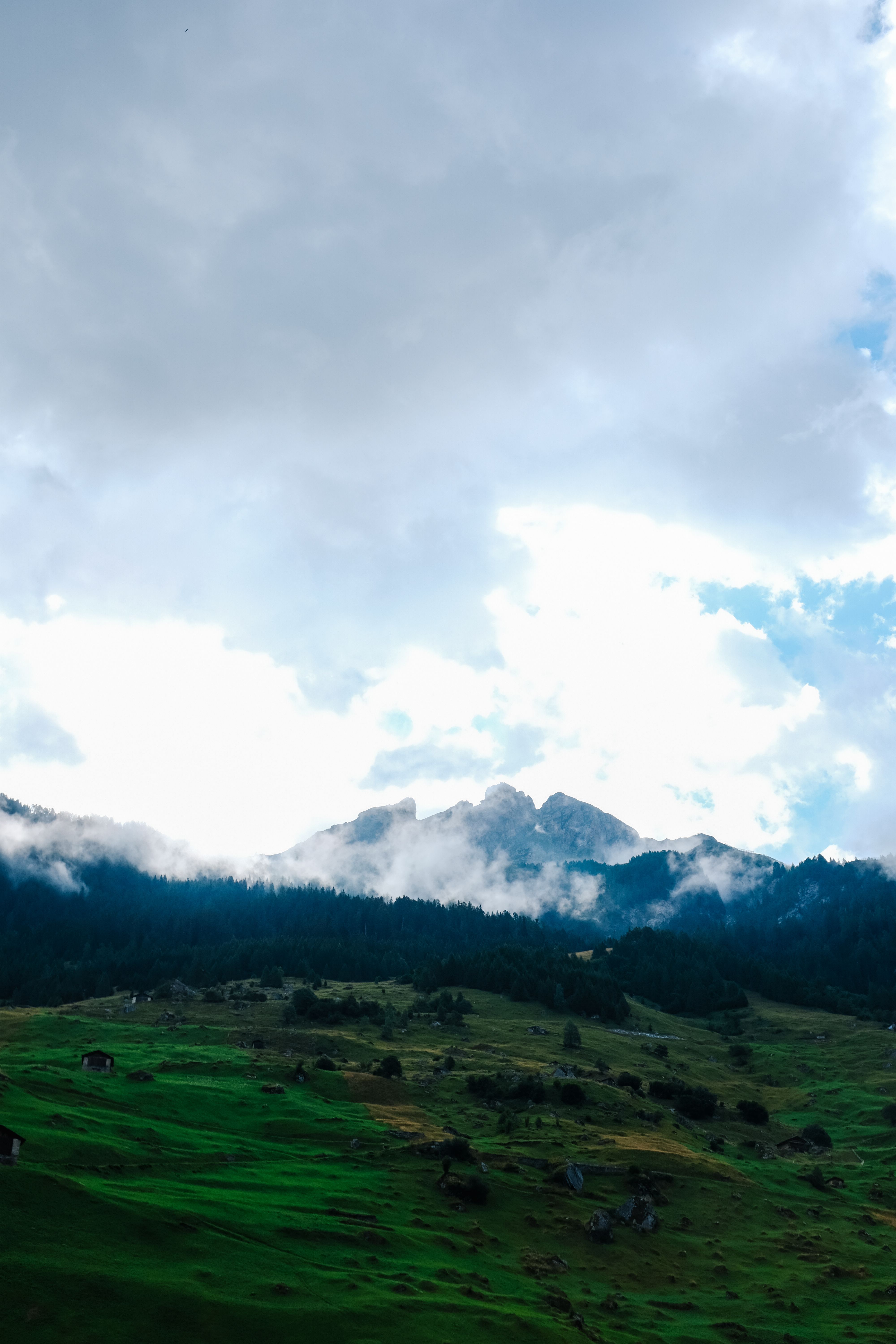 Mountains behind Hill in Countryside · Free Stock Photo