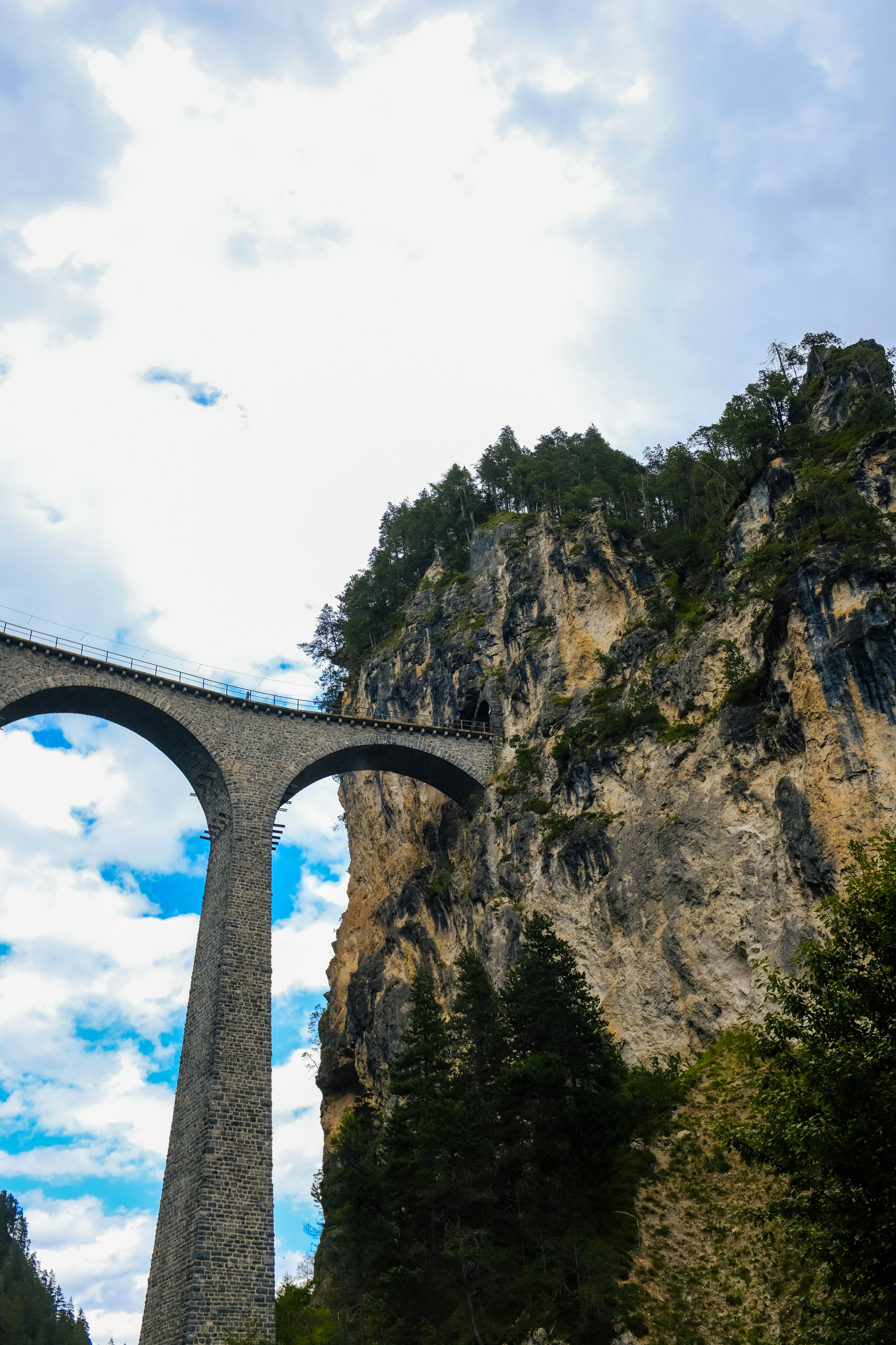 An Arched Bridge by the Rock · Free Stock Photo