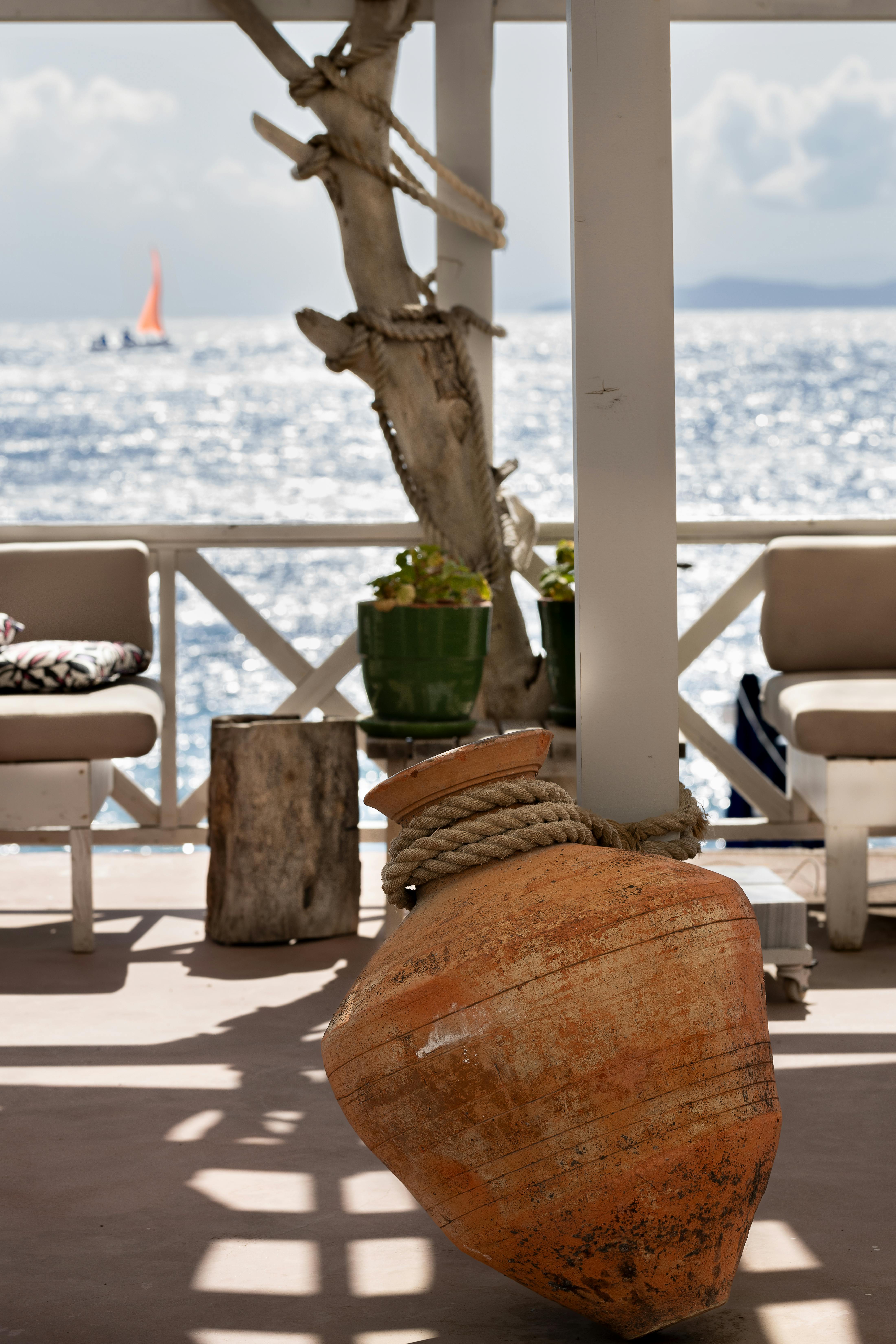 Amphora Decorating Terrace Overlooking Sea · Free Stock Photo