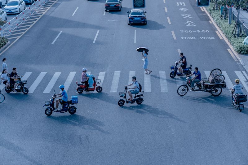 Buses and Scooters along Crosswalk · Free Stock Photo