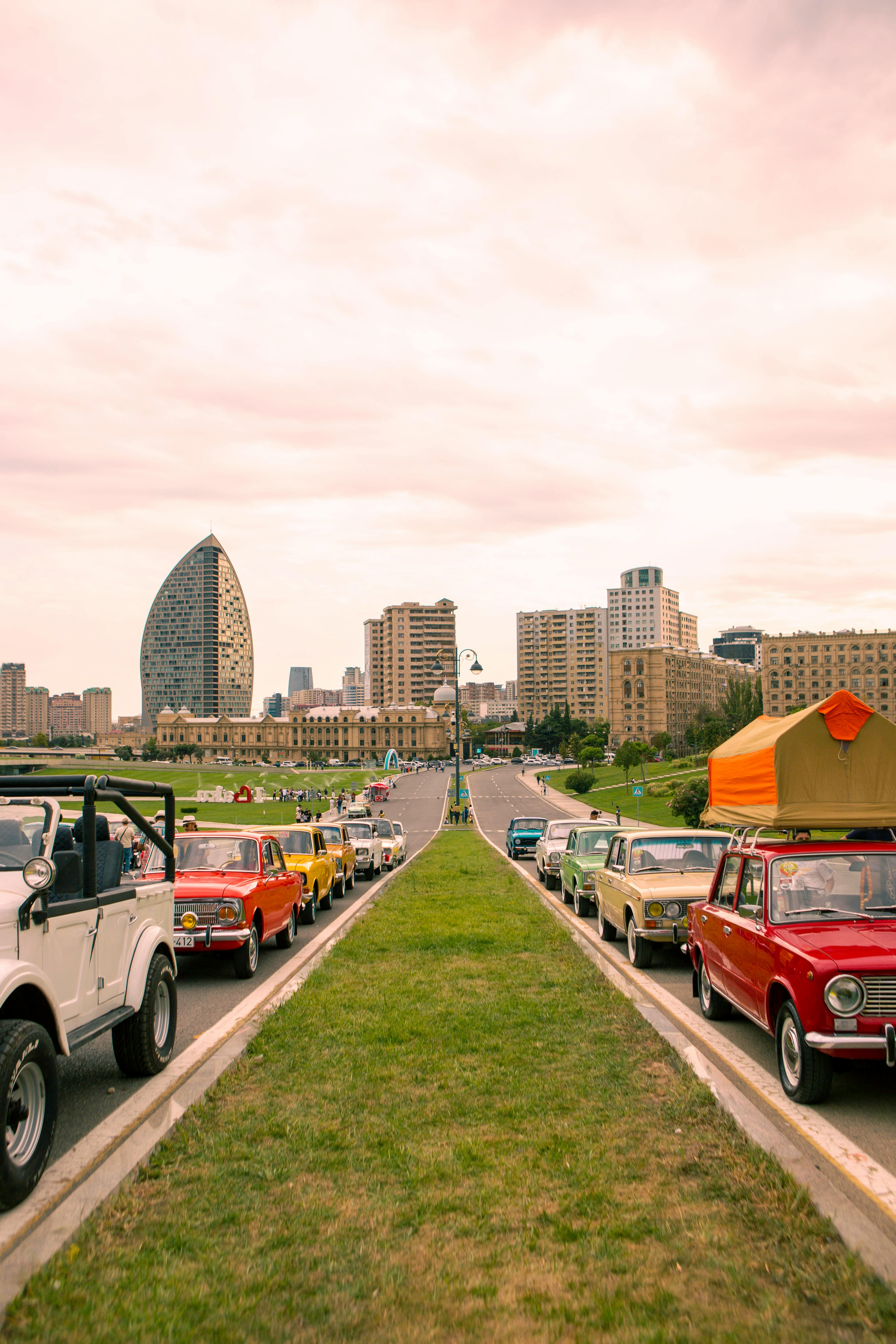 Retro Cars Driving on a Road in Baku · Free Stock Photo
