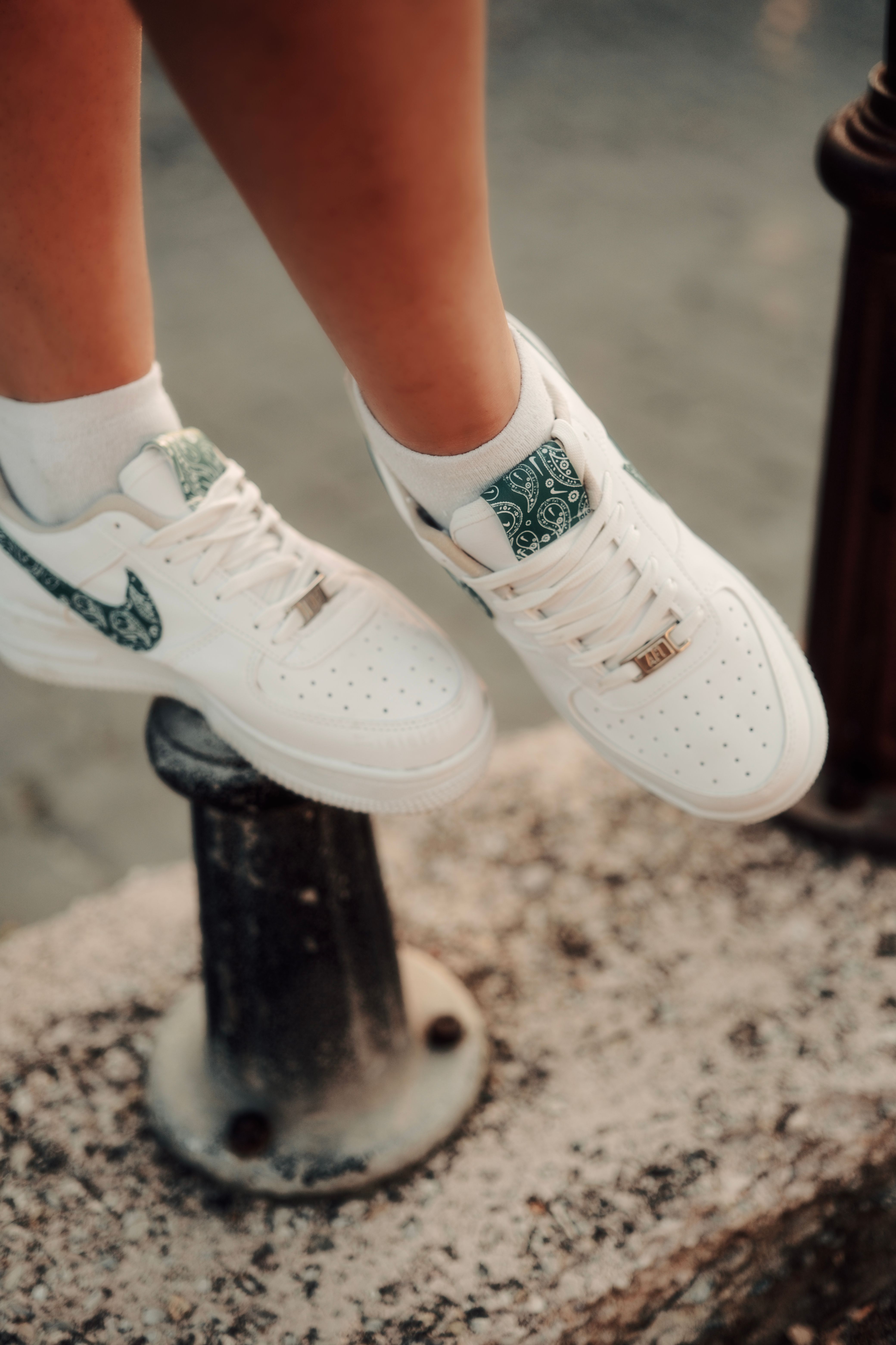 A Person Wearing Nike Air Force 1 Sneakers · Free Stock Photo