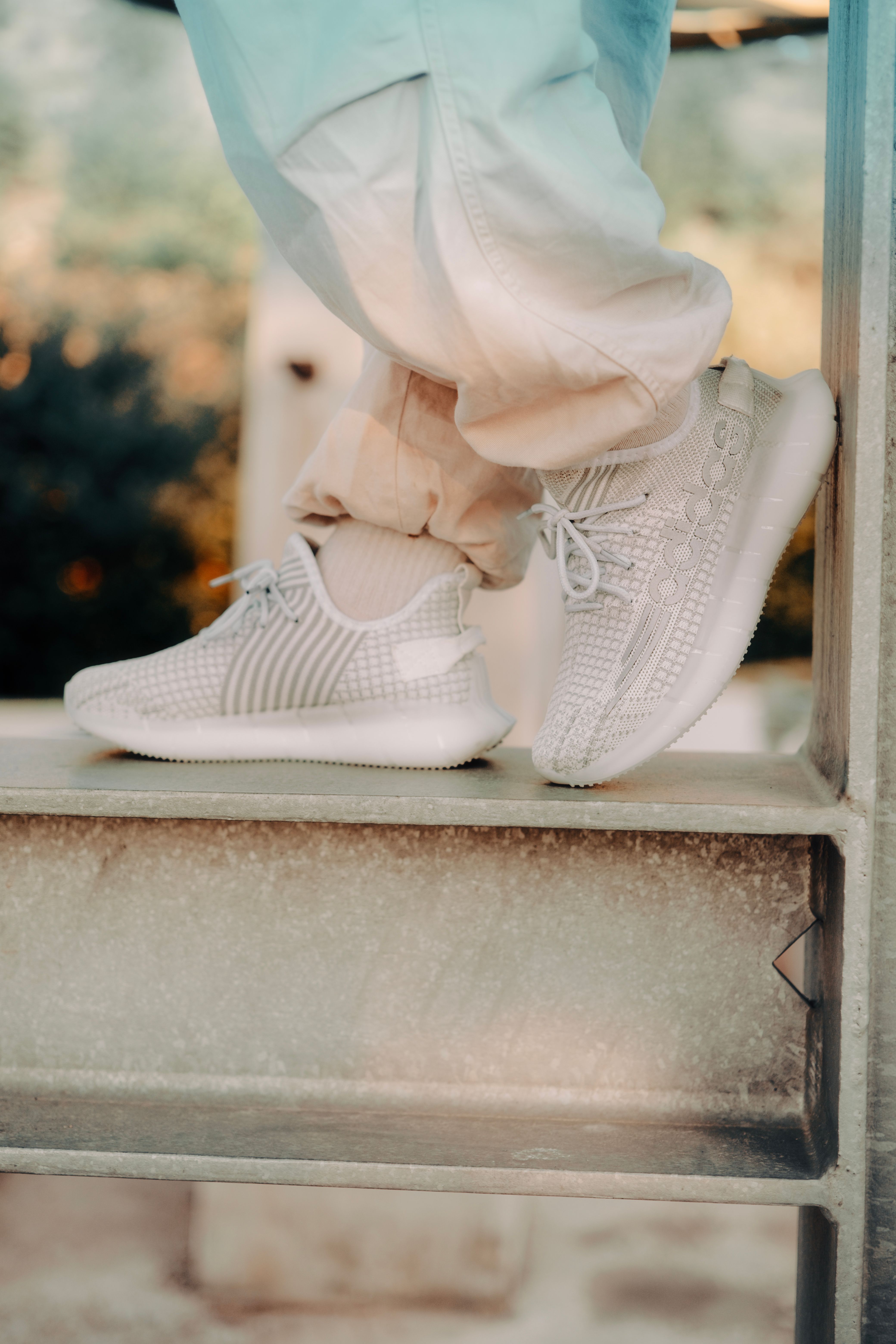 A Person Wearing White Crocs · Free Stock Photo