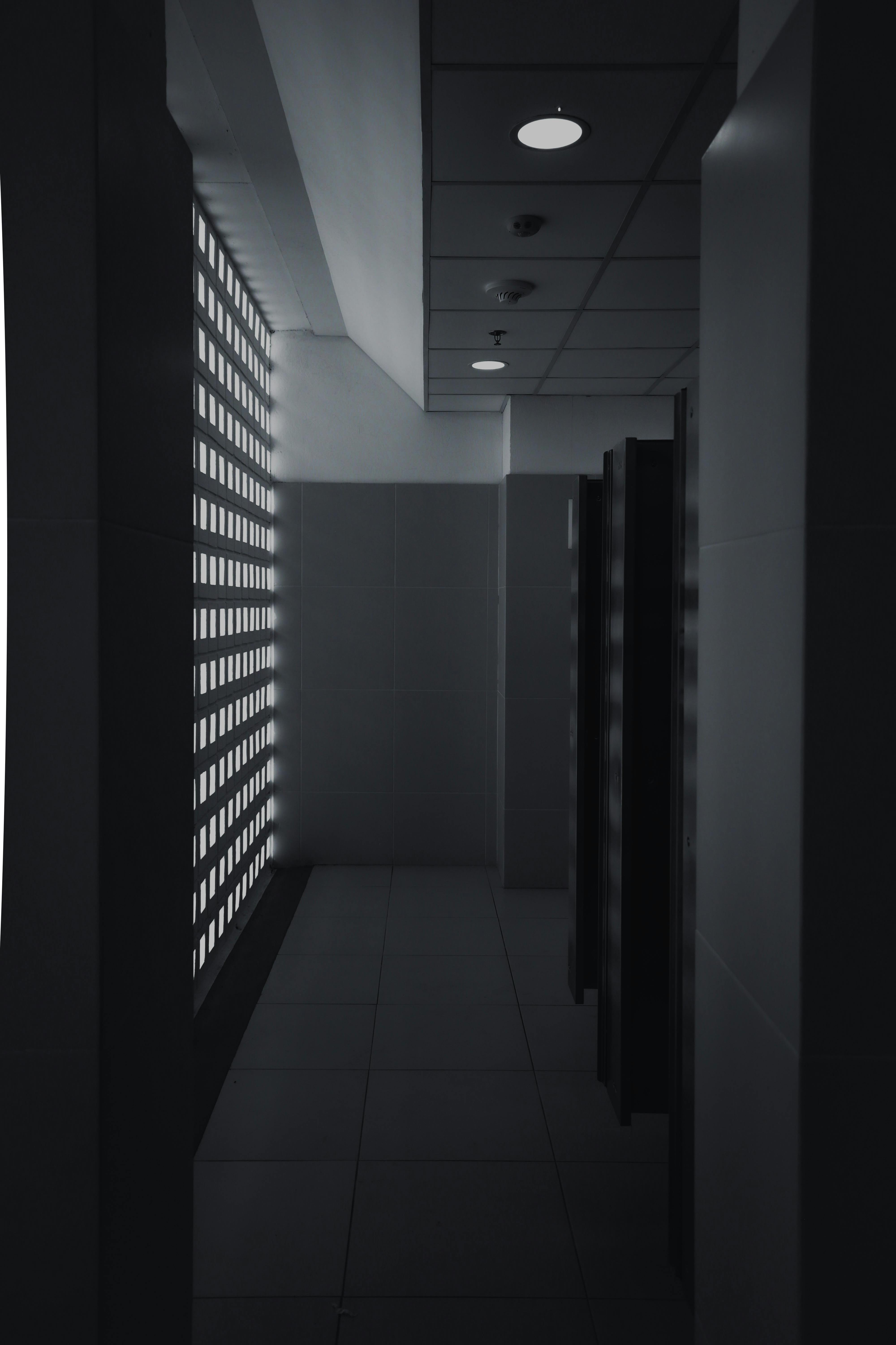 Black and White Photo of a Dark Empty Hallway · Free Stock Photo