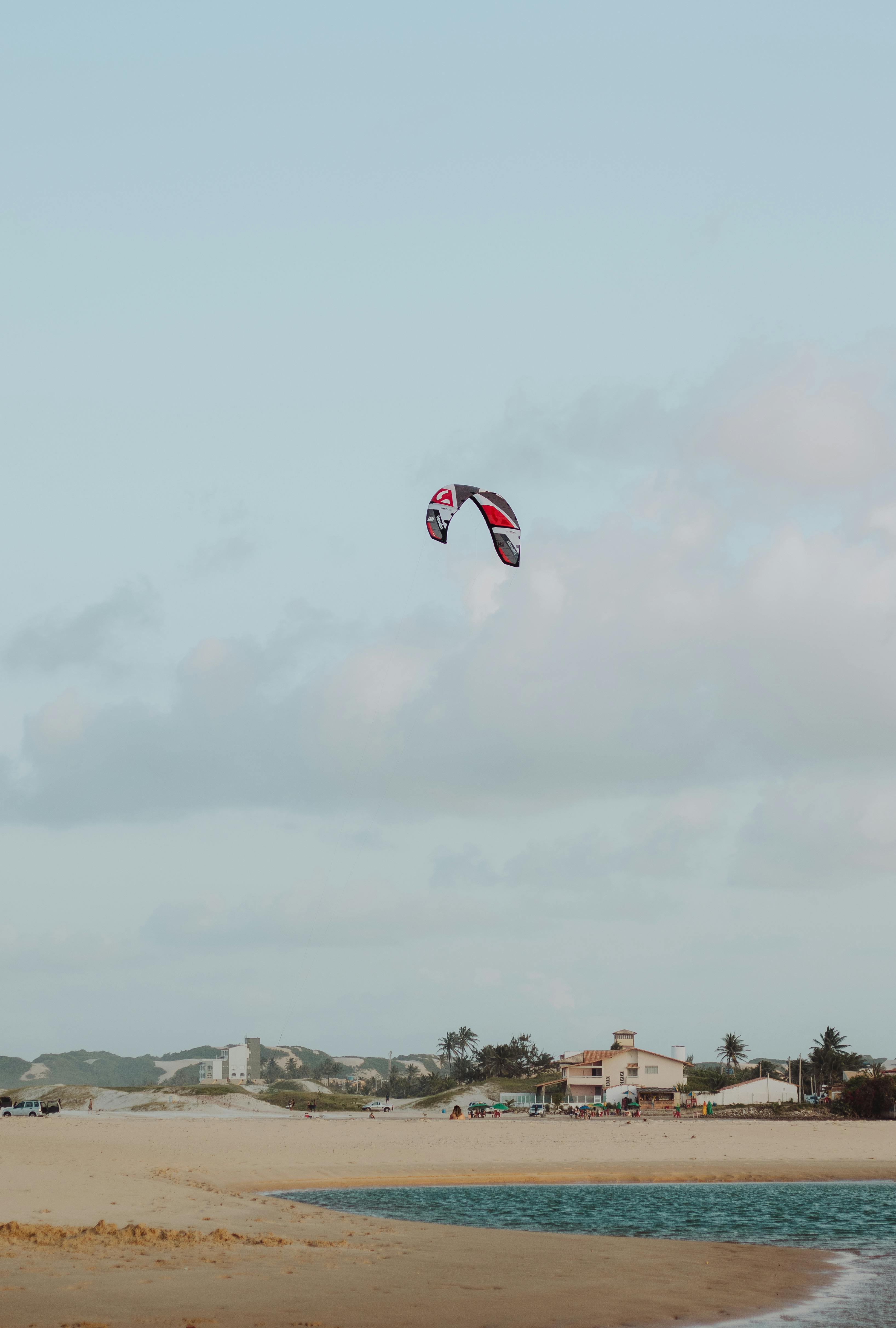 A Kite Flying over the Beach · Free Stock Photo