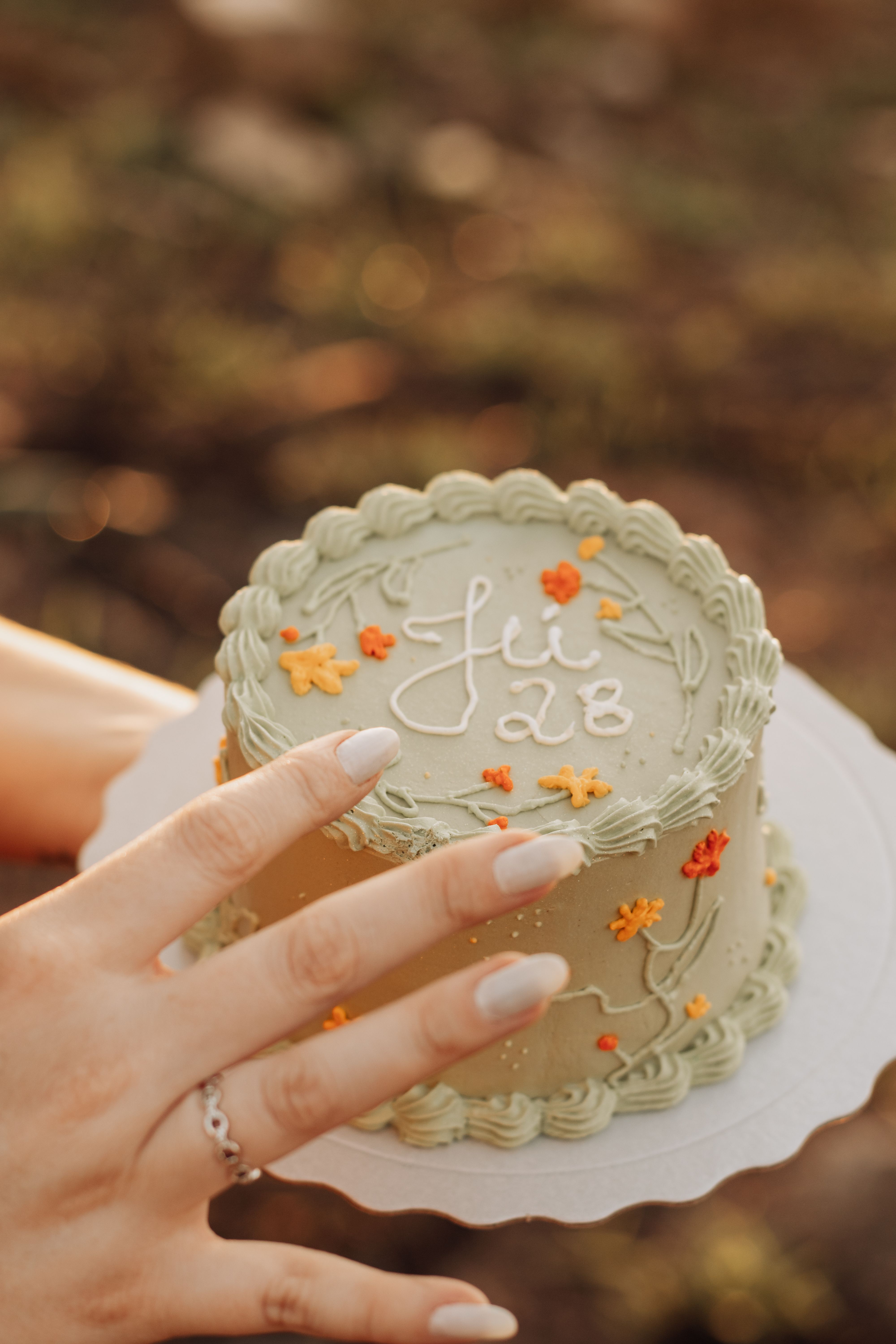 Woman Hand over Birthday Cake · Free Stock Photo