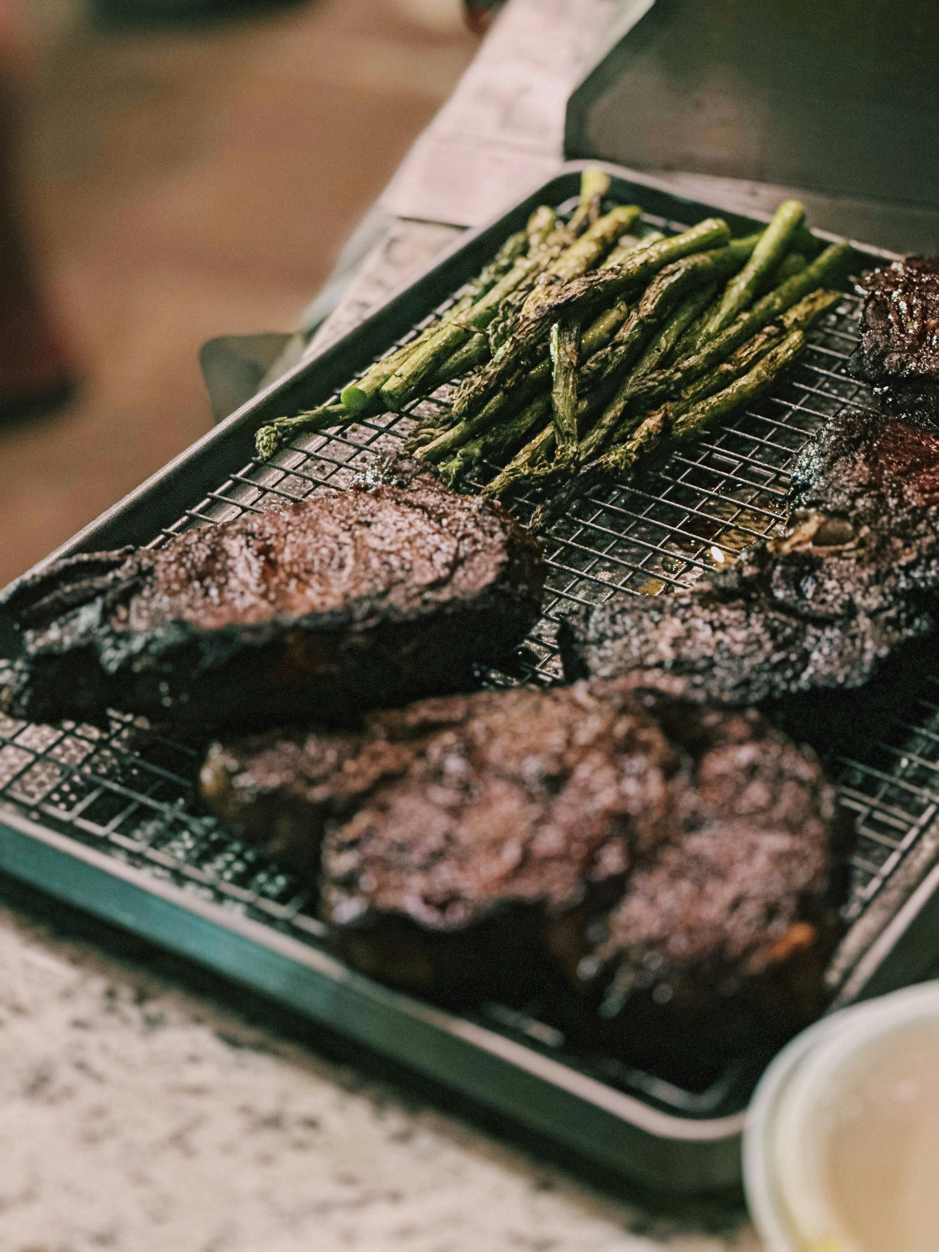 Person Seasoning the Steak · Free Stock Photo