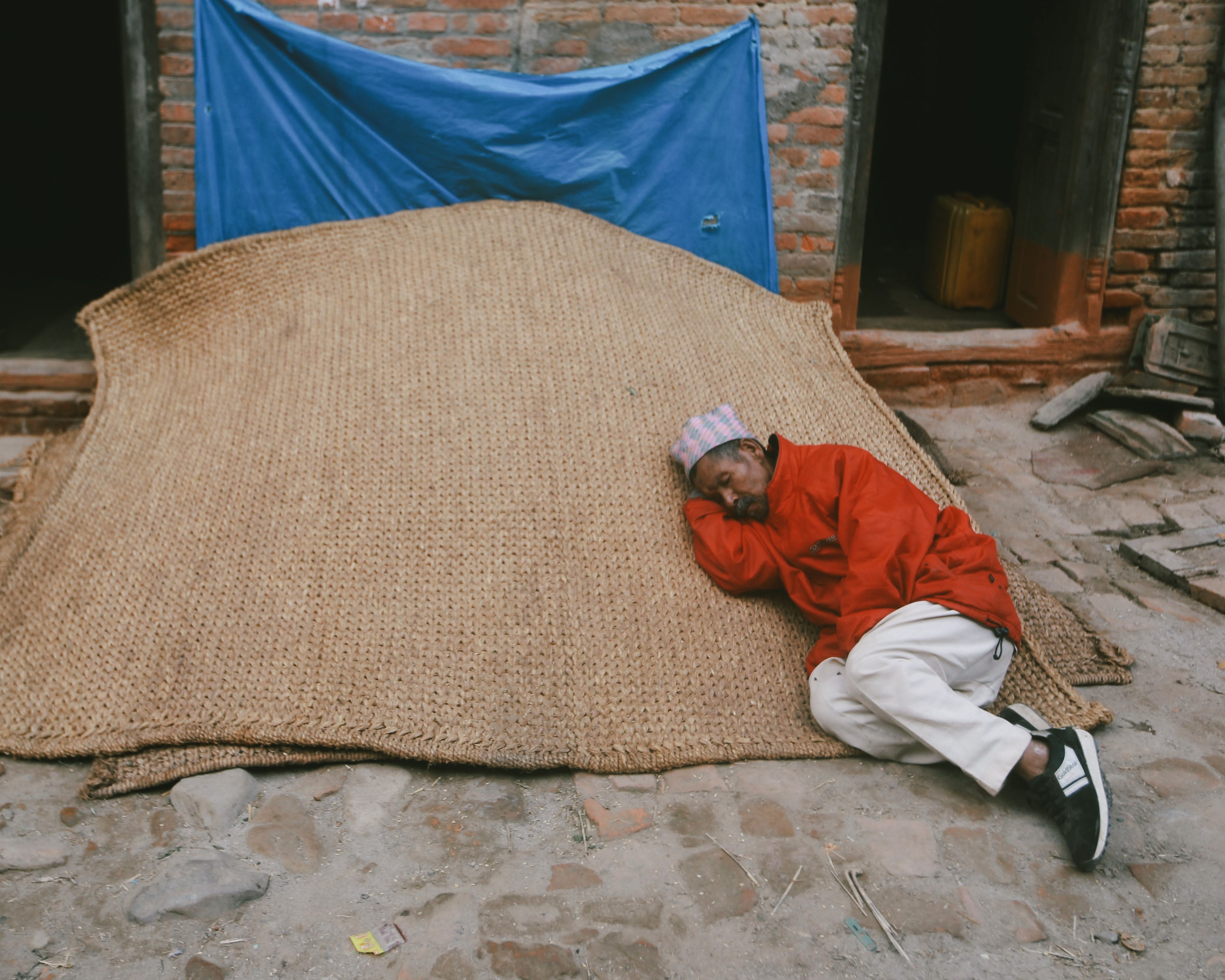 Elderly Man Sleeping on Pavement · Free Stock Photo