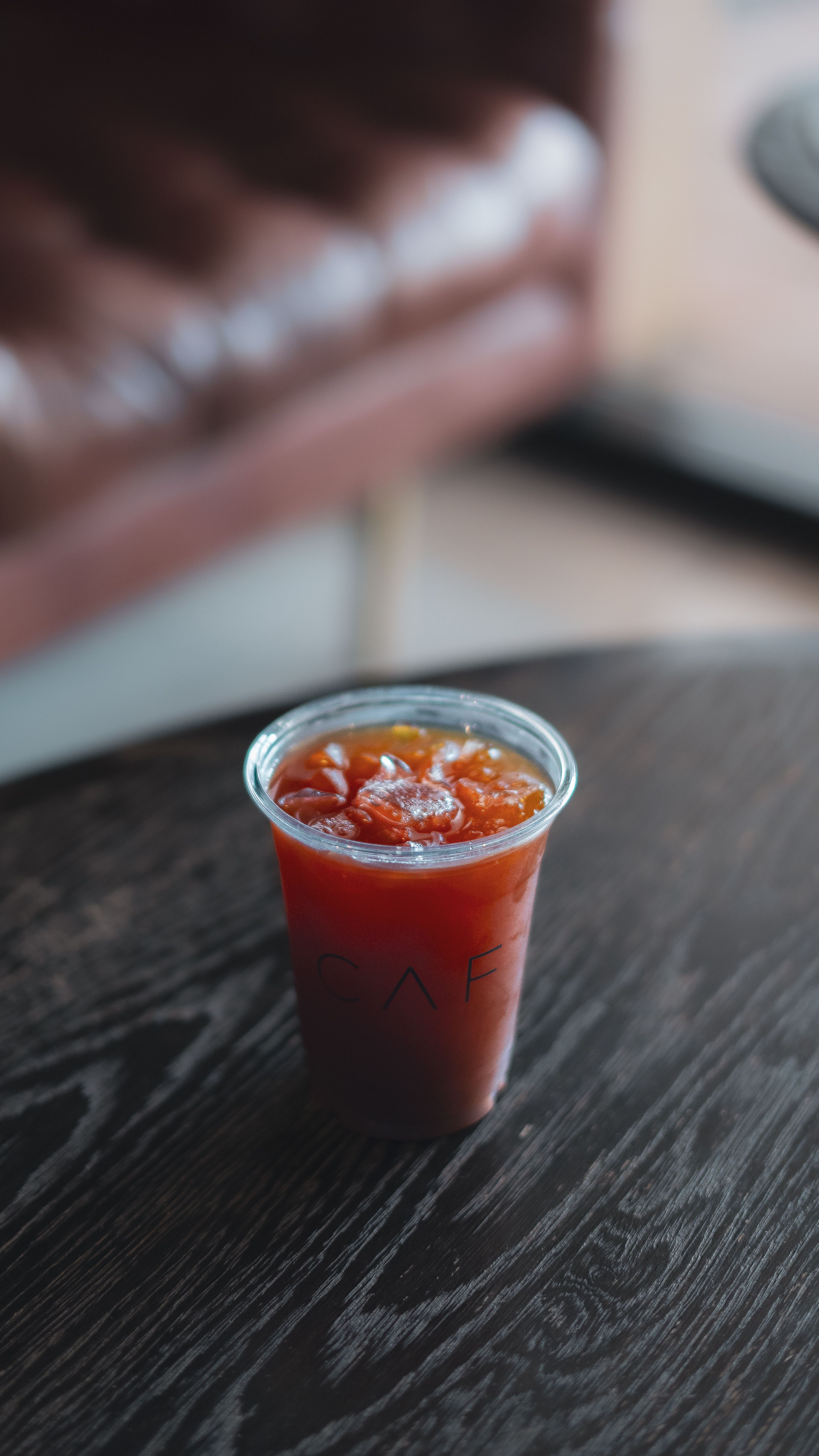Close-up Photo of Red Beverage Full of Ice Cubes In Front of Black ...
