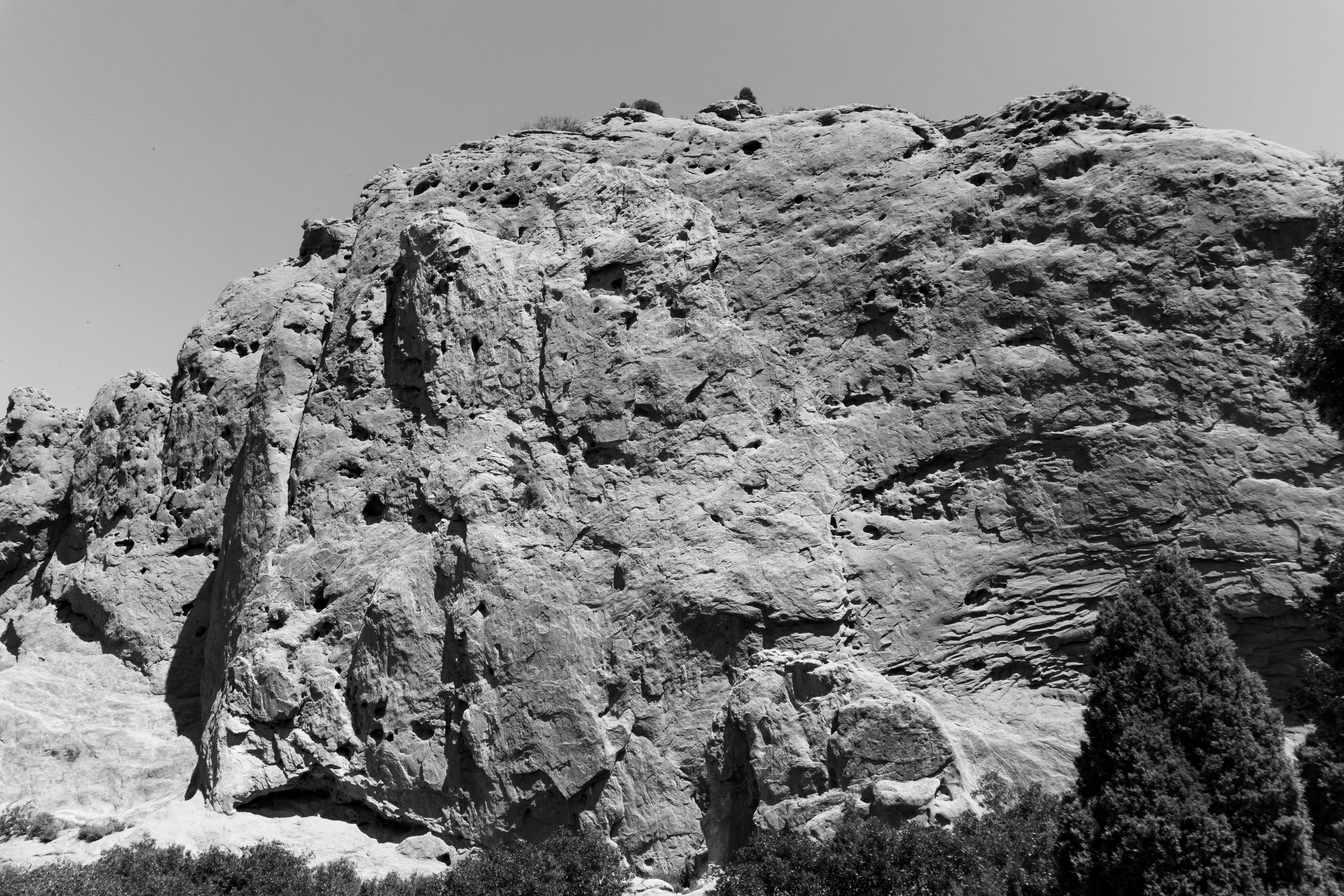 Pocked Red Rock Face Black and White · Free Stock Photo