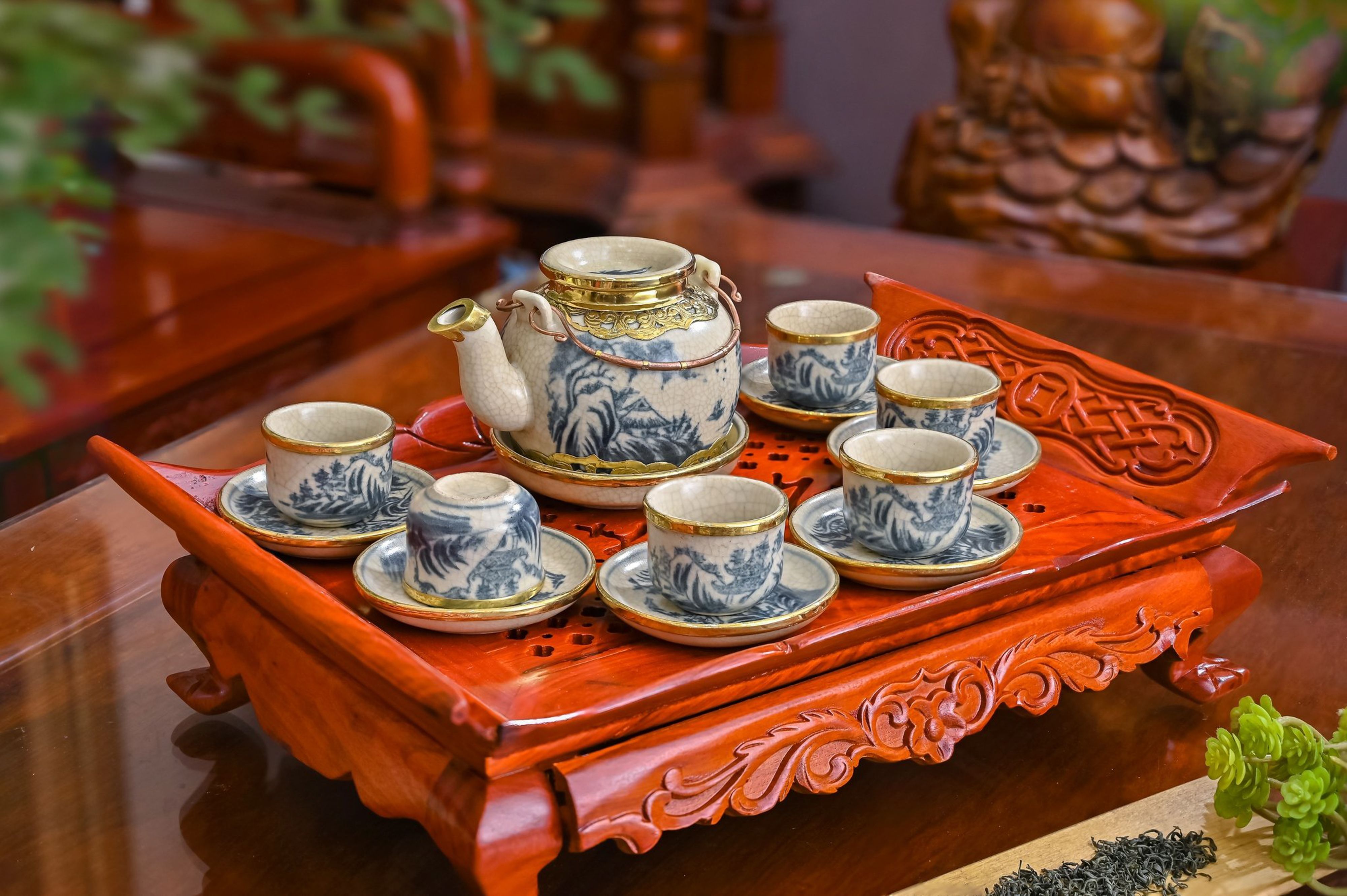 A Ceramic Tea Set Standing on a Carved Tray · Free Stock Photo
