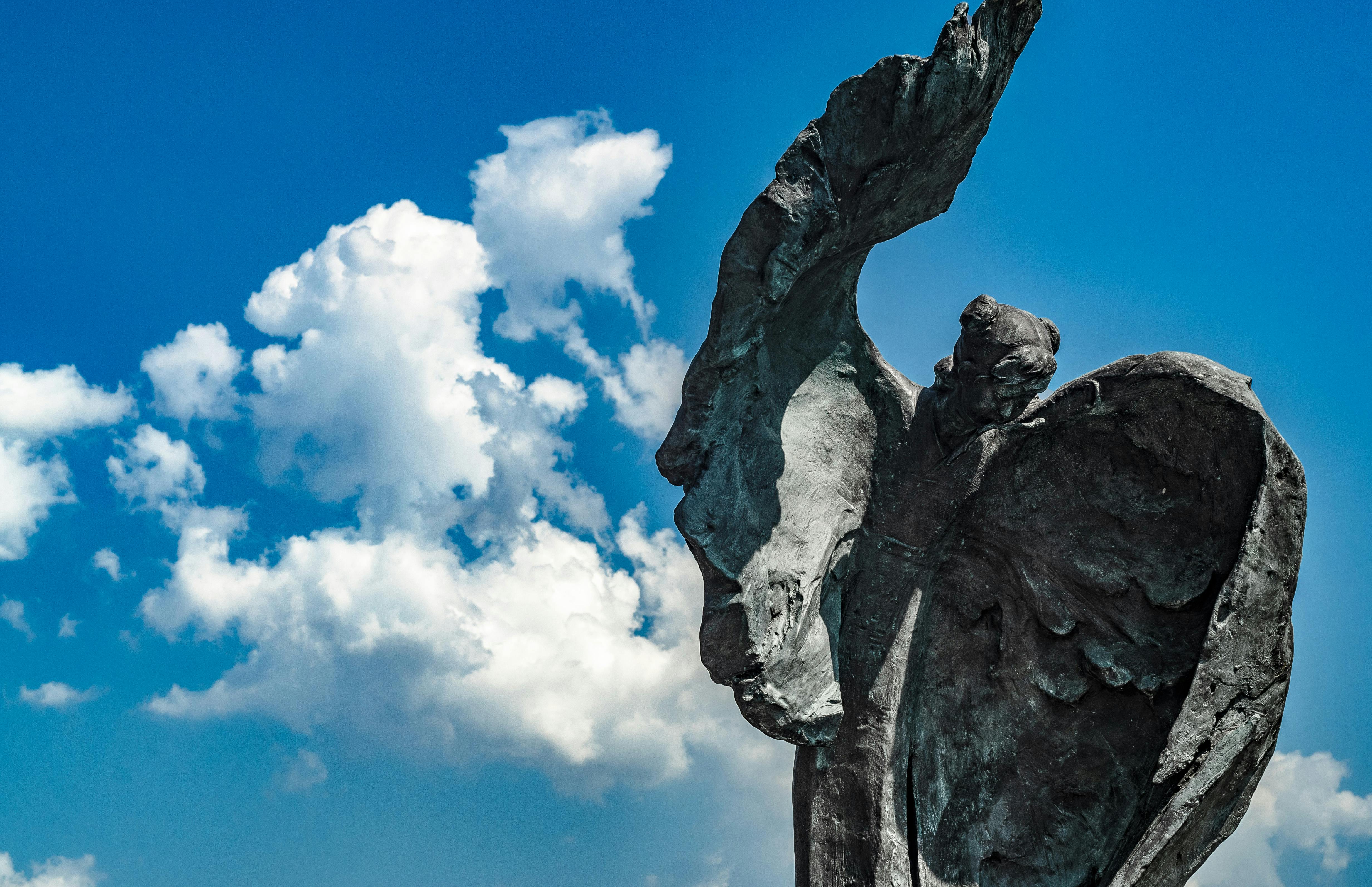 Stone Sculpture and Clouds behind · Free Stock Photo