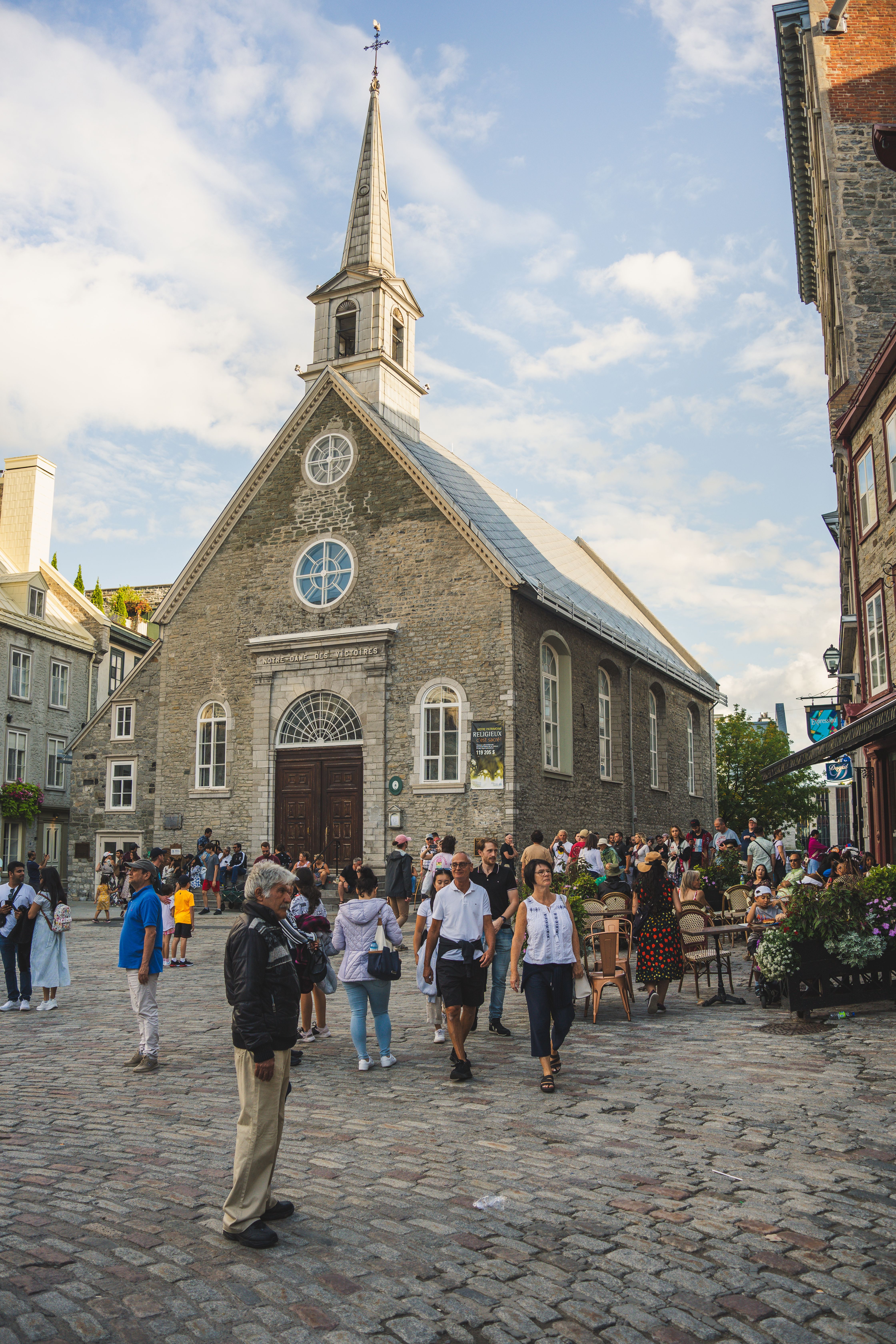 People near Notre-Dame-des-Victoires Catholic Church in Quebec in ...