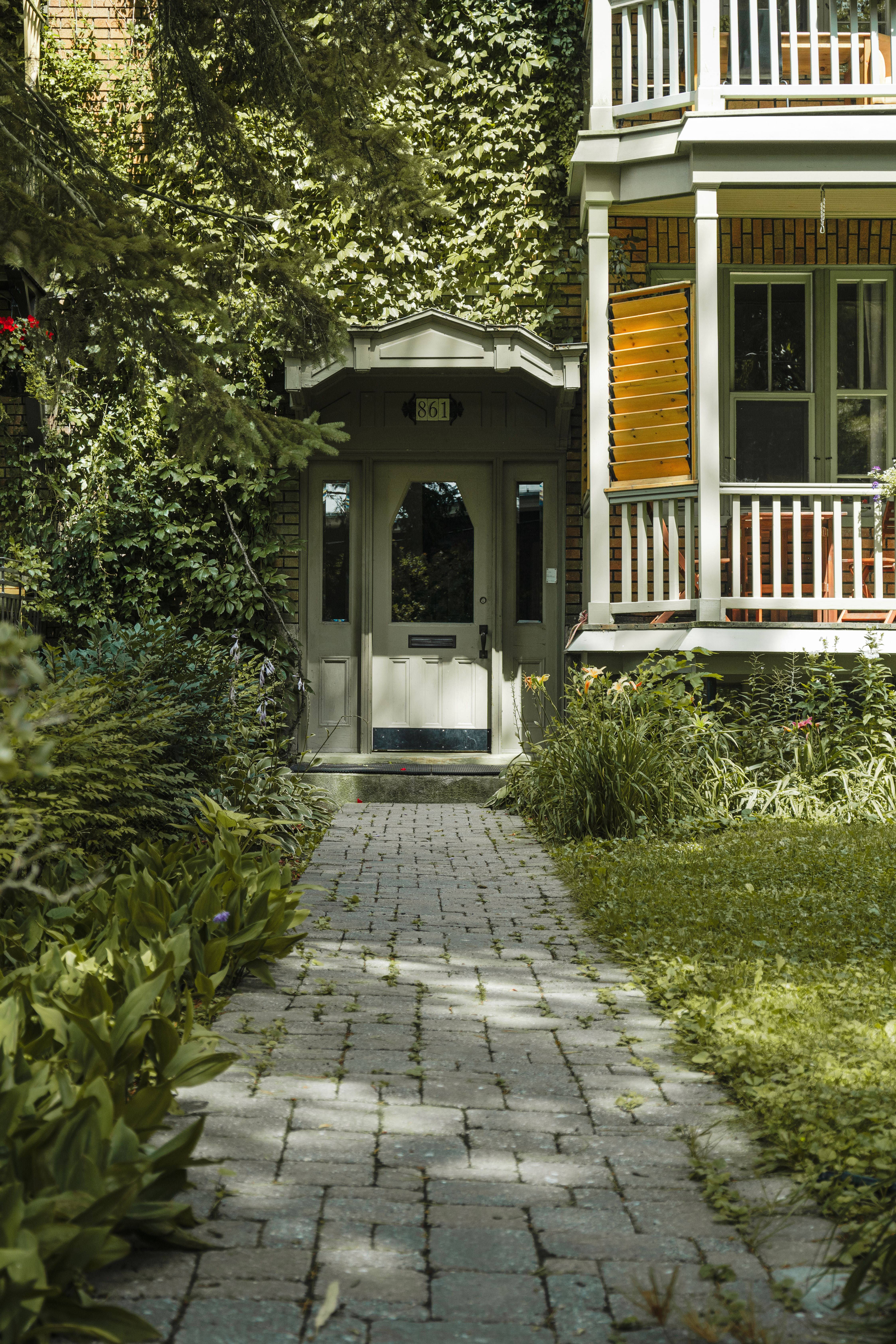 Wooden Bower Next to a House · Free Stock Photo