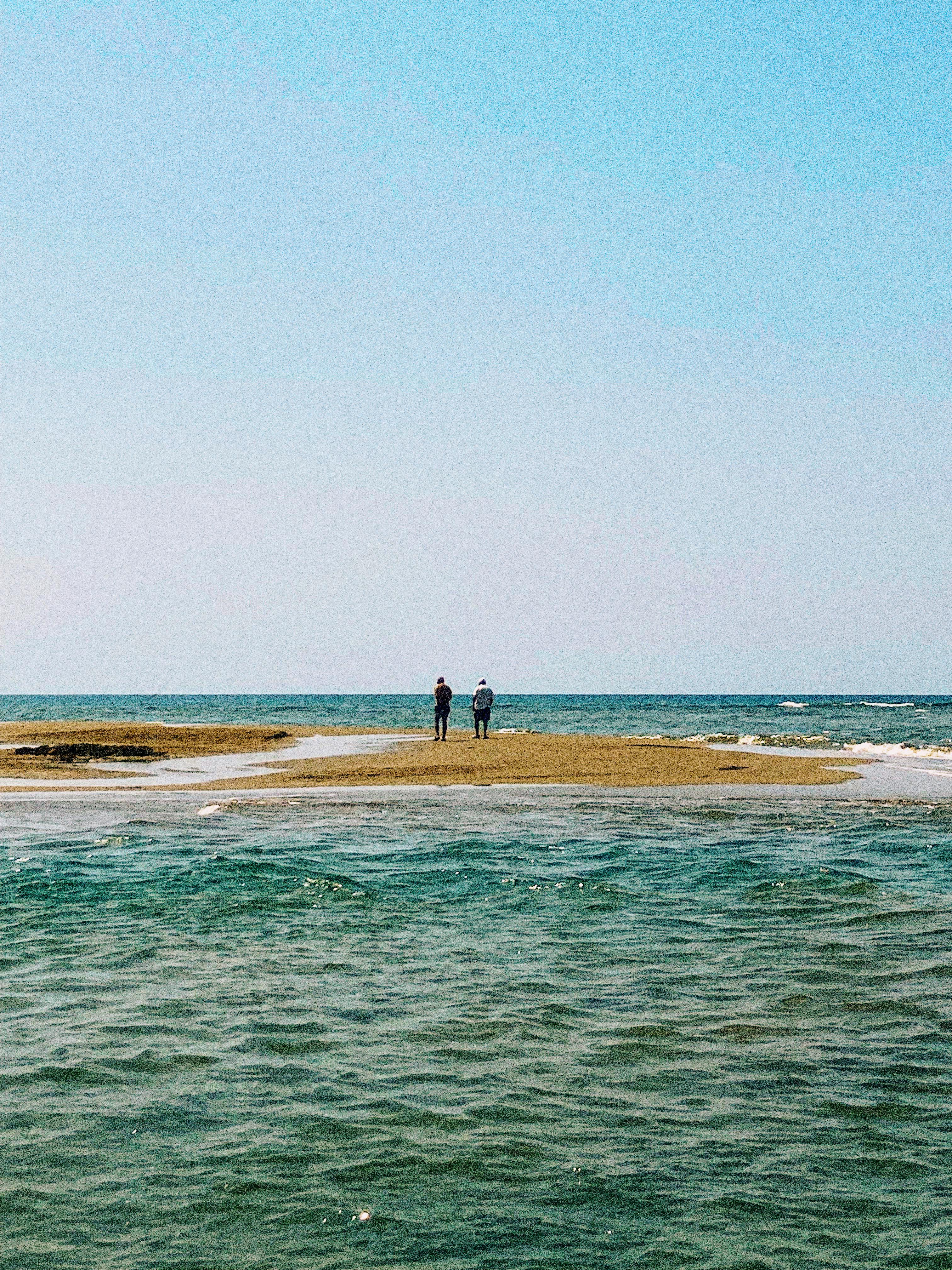 People on an Island Among Sea · Free Stock Photo