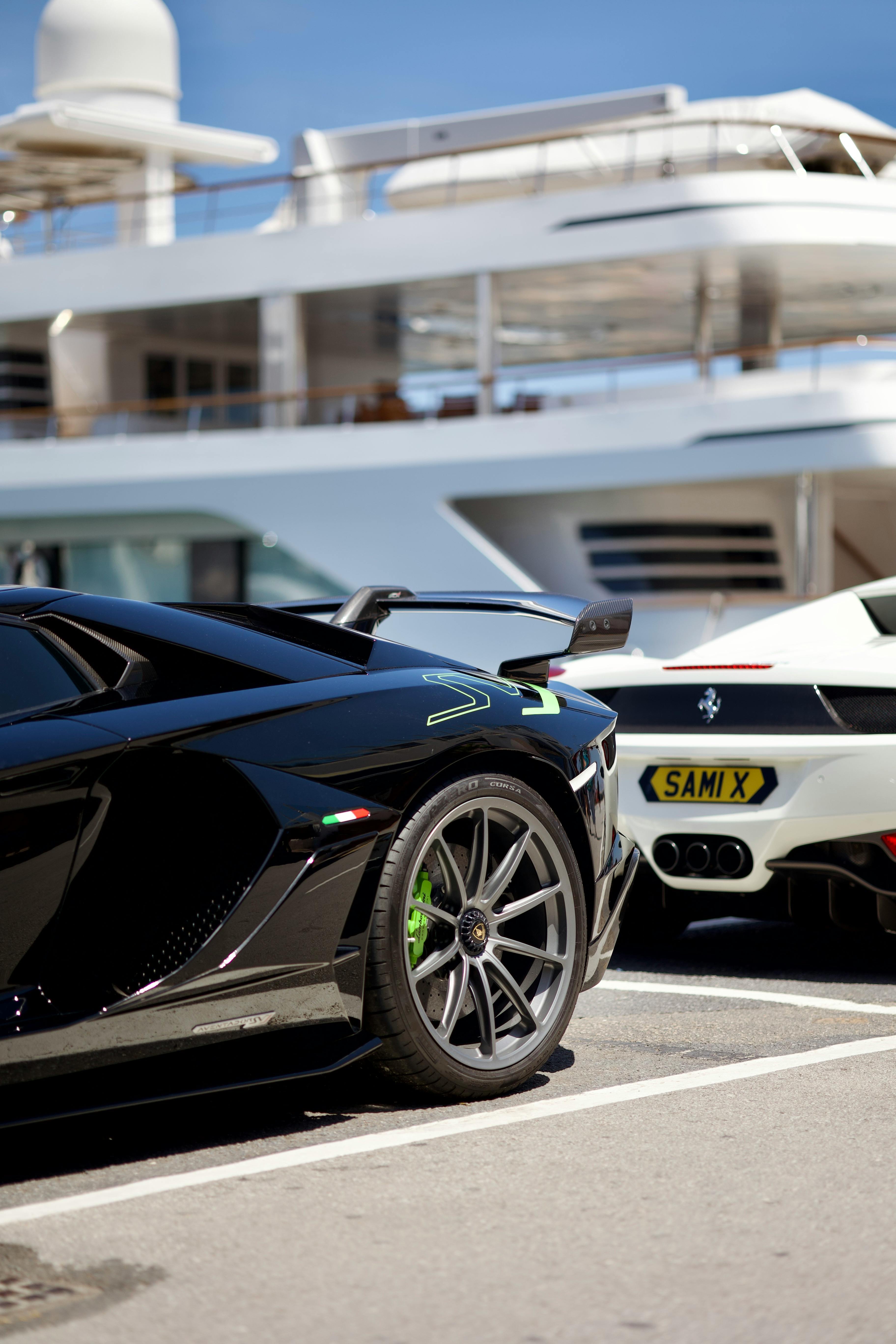 Lamborghini Huracan and Ferrari behind · Free Stock Photo