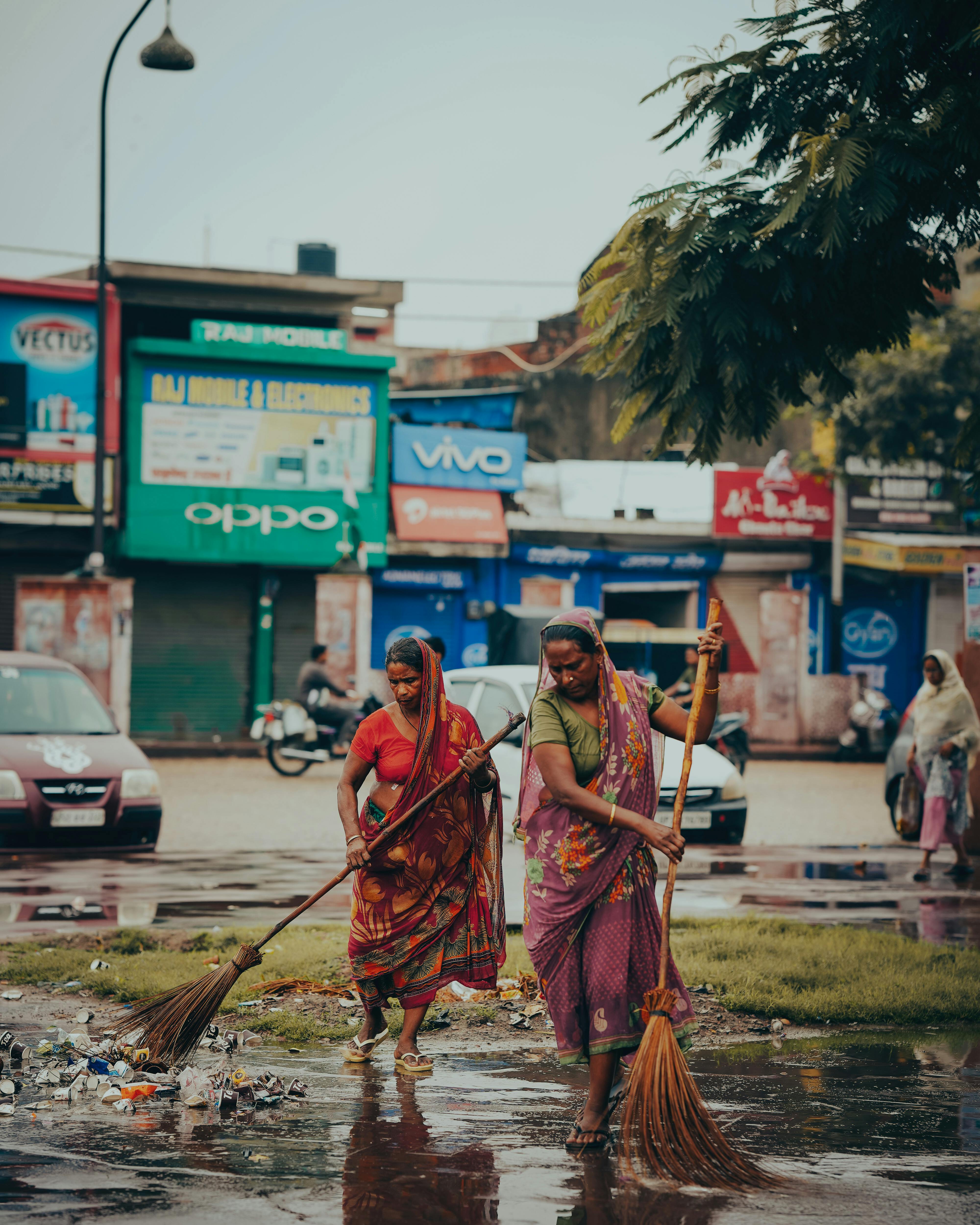 Women Sweeping the Street · Free Stock Photo