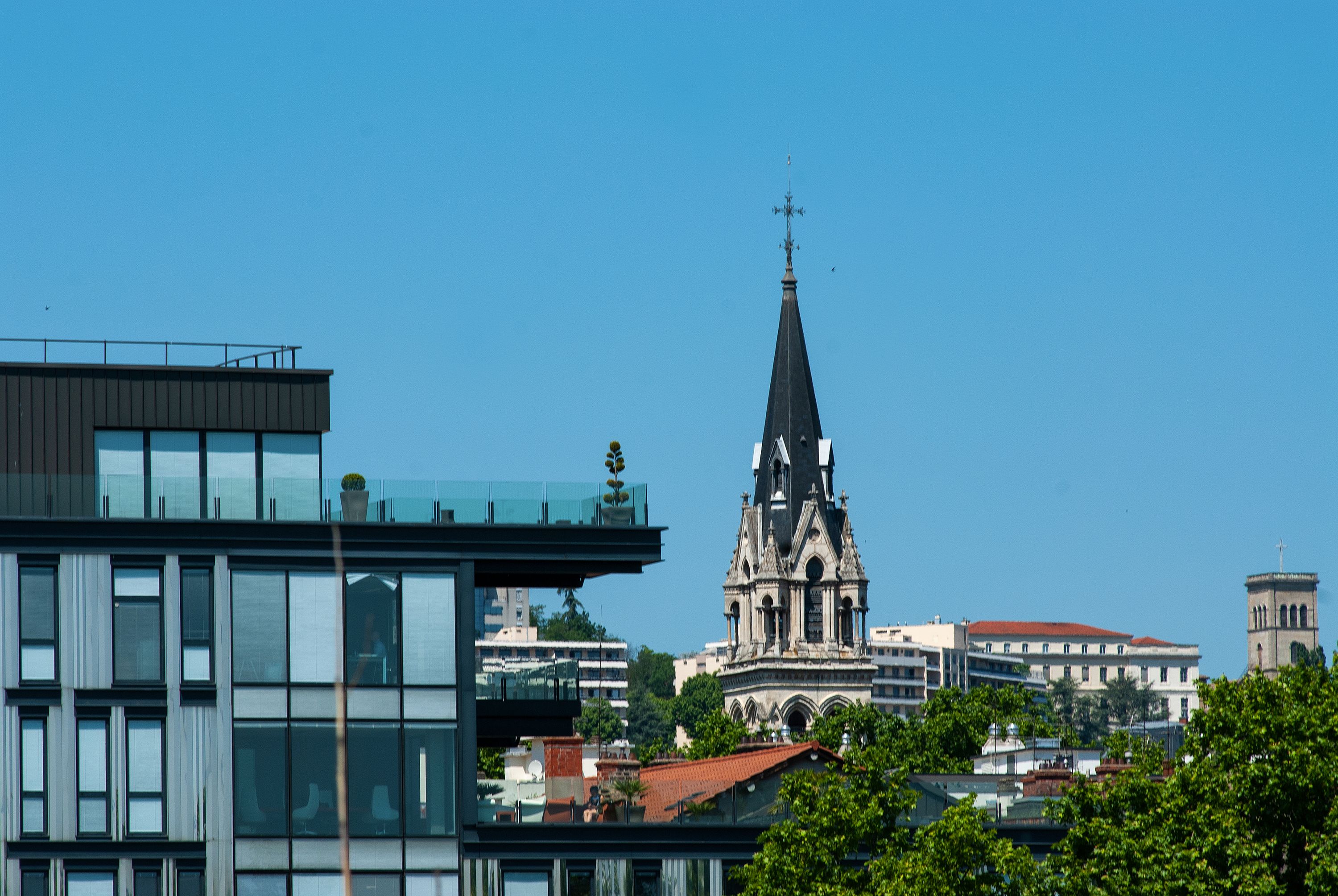Bell Tower of a Historic Church Among Modern Apartment Buildings · Free ...