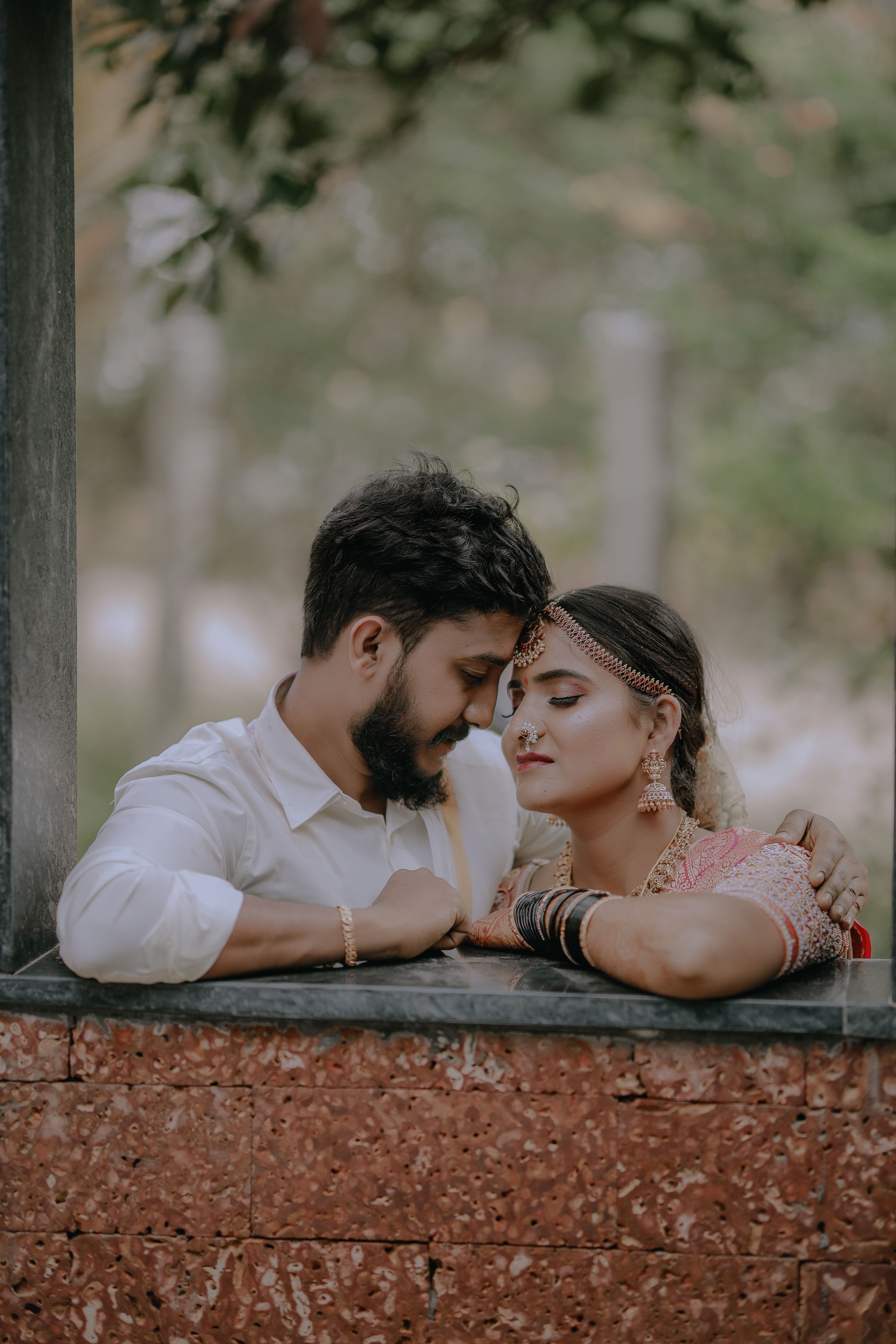 Couple with Eyes Closed Together by Wall · Free Stock Photo