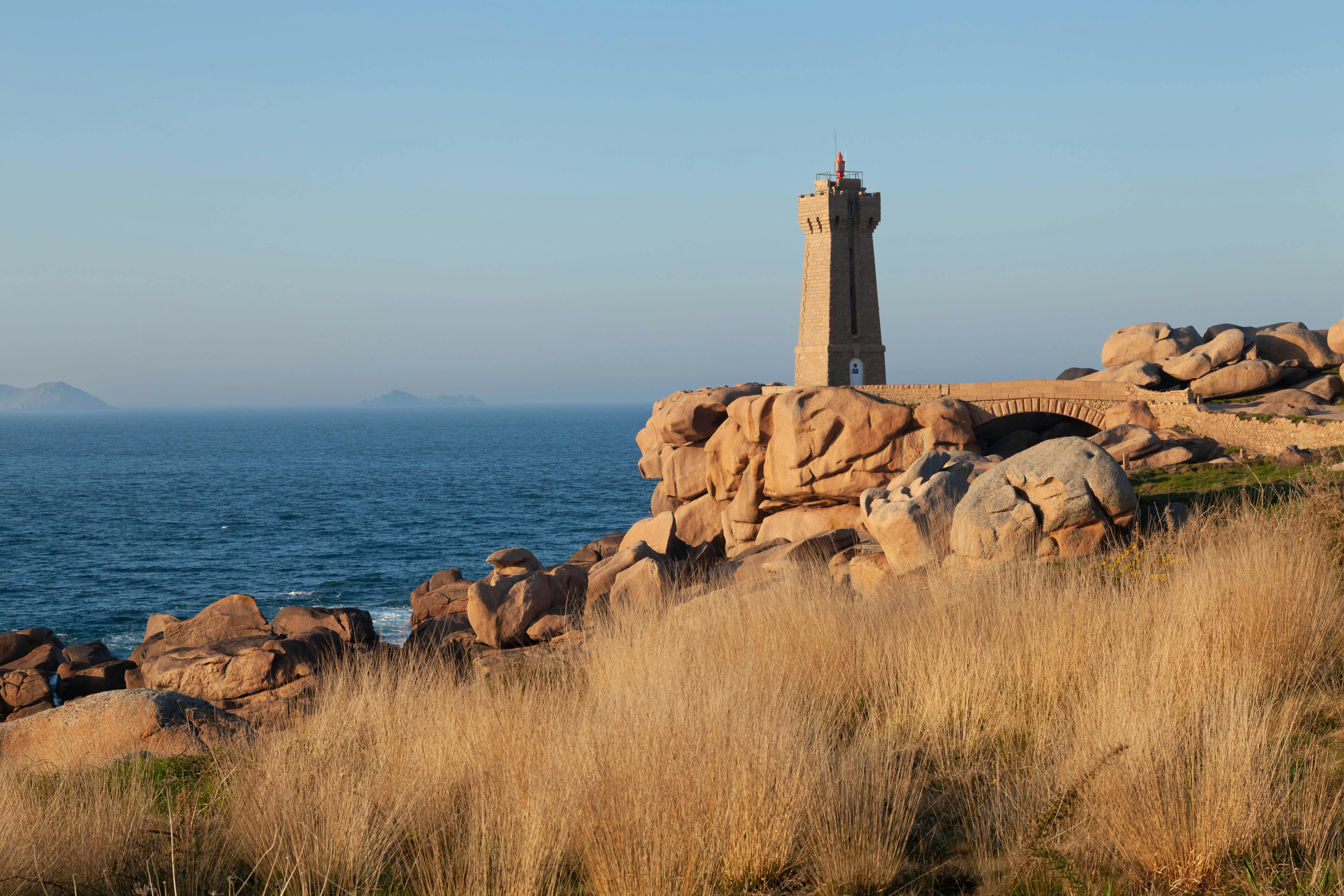 Red Granite Lighthouse on the Sea Cliff · Free Stock Photo