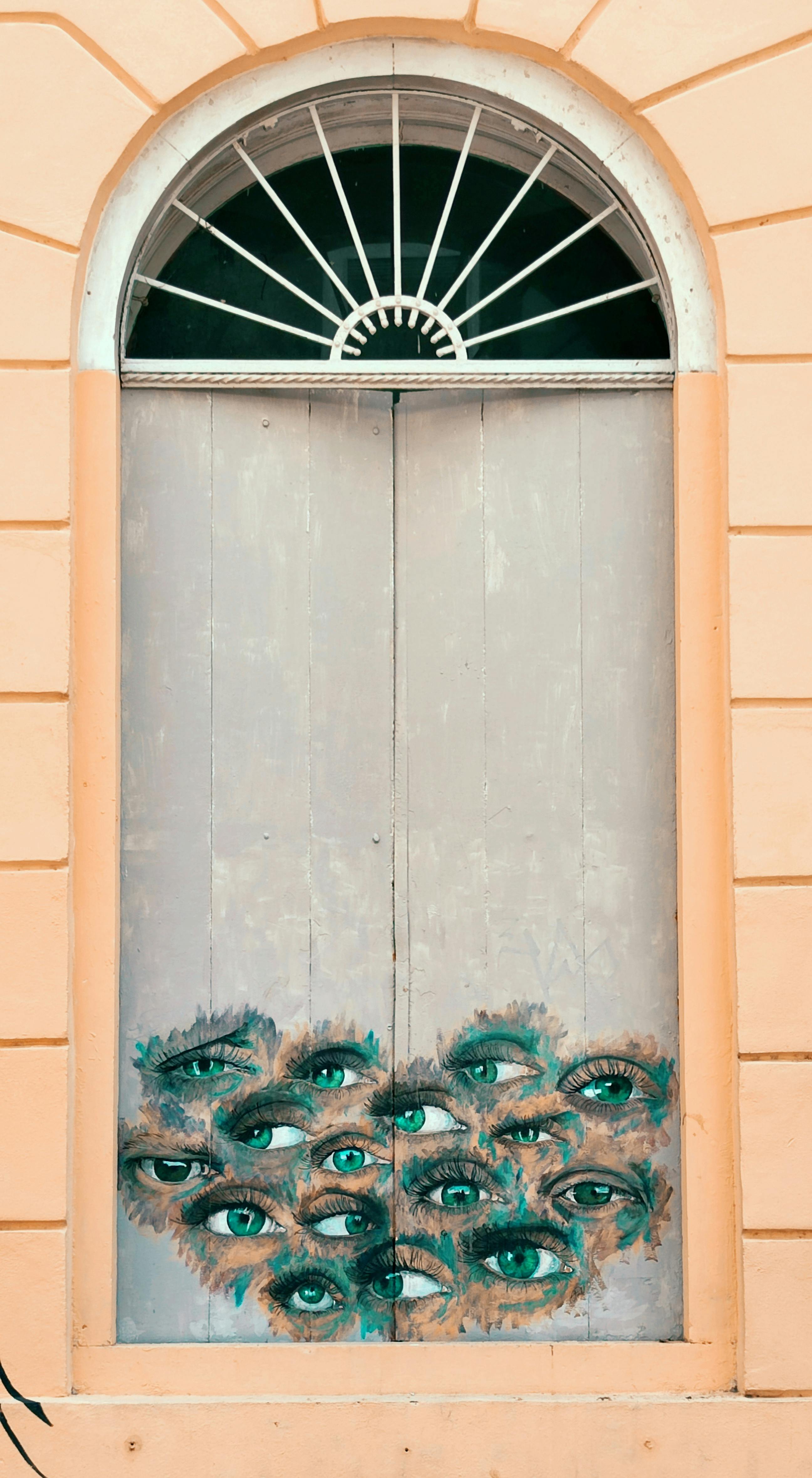 Eyes on Window Shutters · Free Stock Photo
