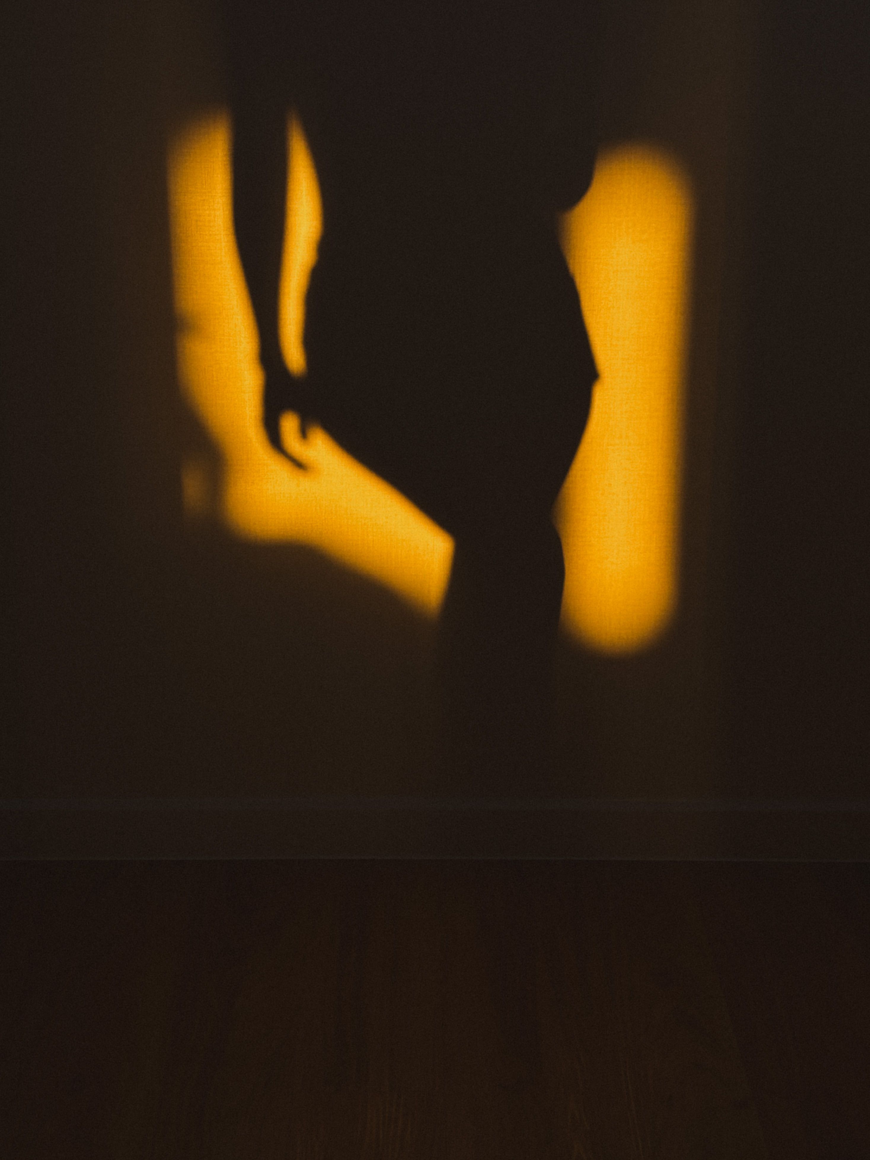 Shadow of a Woman on the Wall · Free Stock Photo
