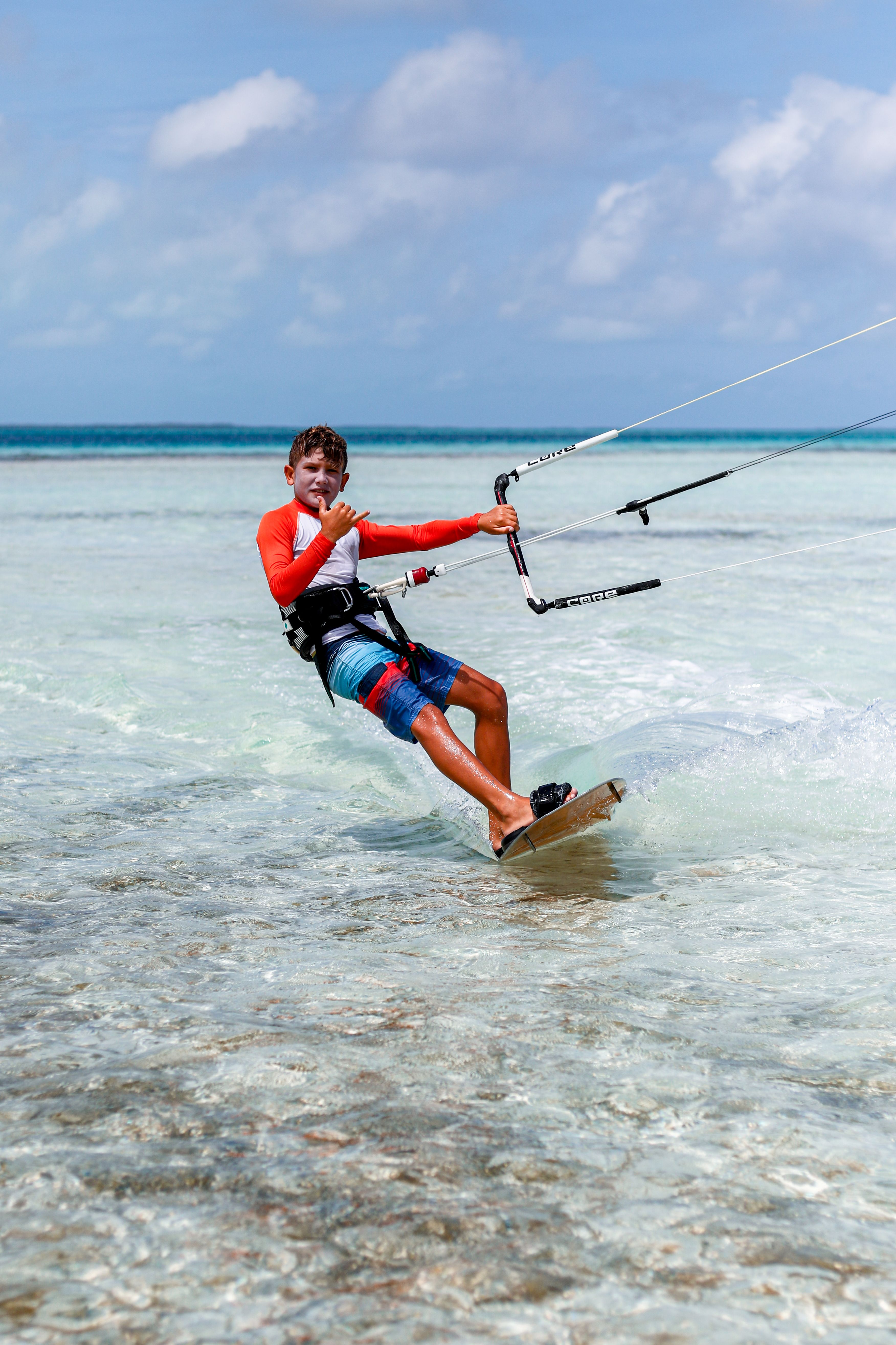 Kitesurfing Boy Showing Shaka · Free Stock Photo