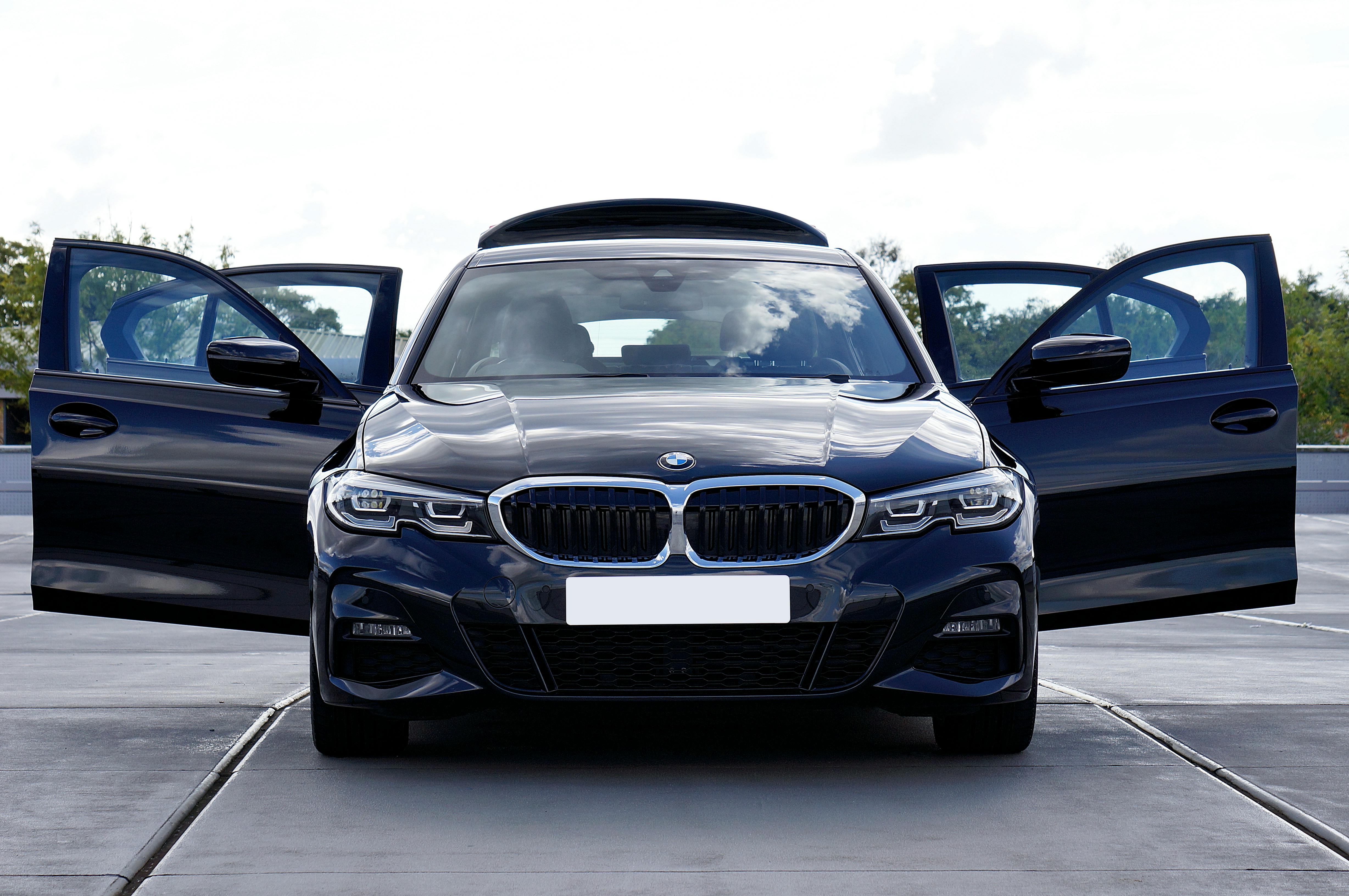 Black BMW with Open Doors · Free Stock Photo