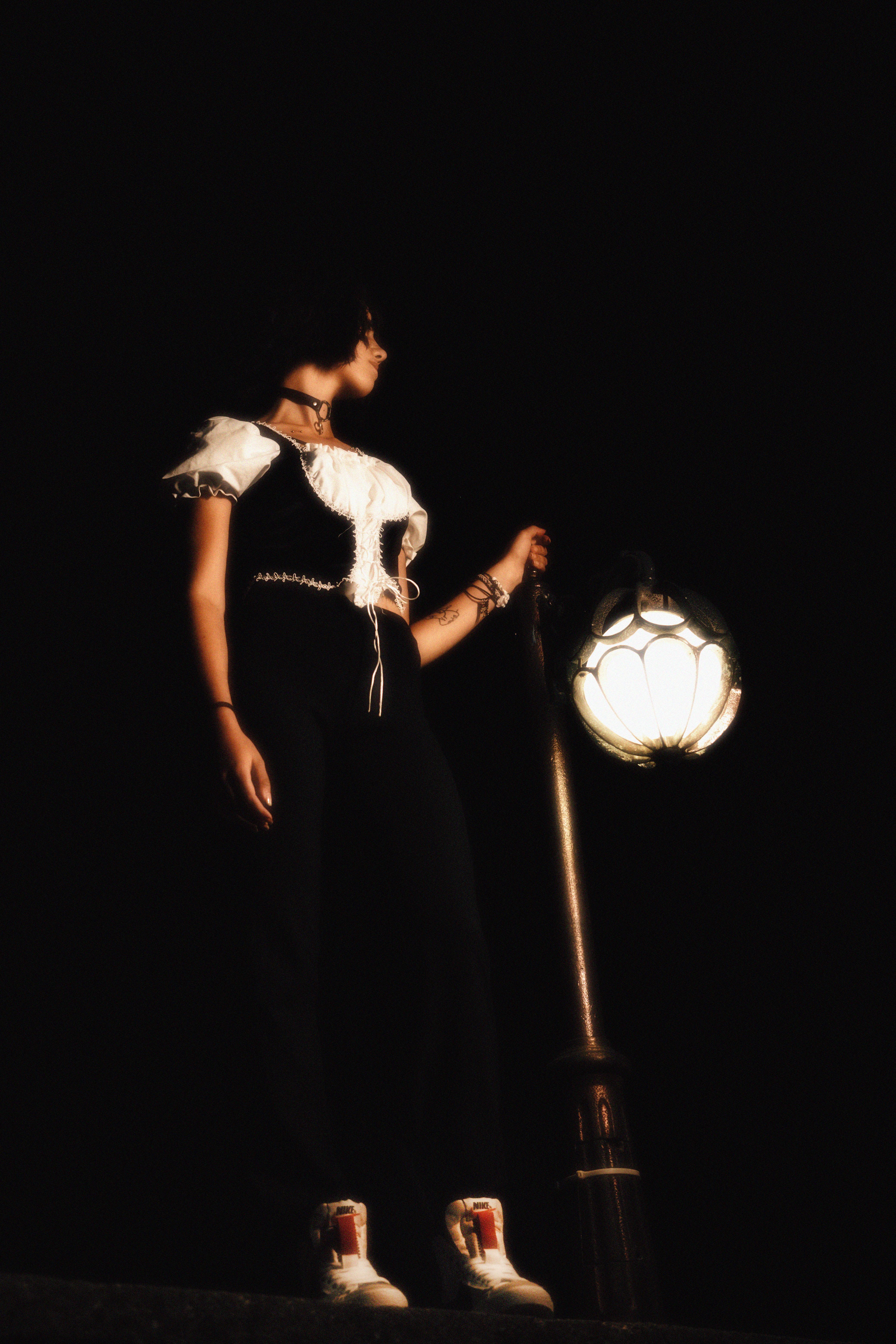 Woman Posing by Lamp at Night · Free Stock Photo