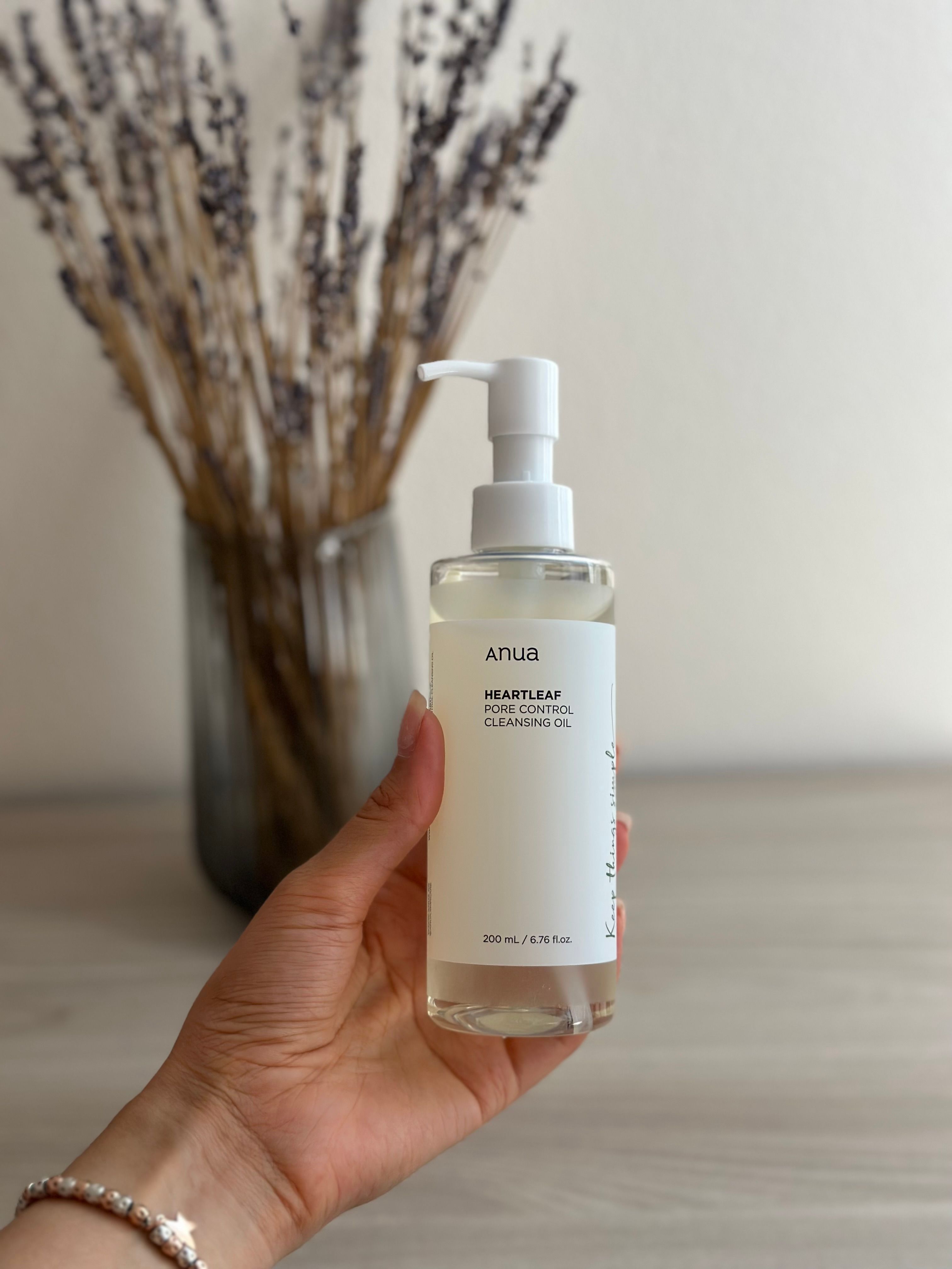 Woman Hand Holding Cleansing Oil Bottle · Free Stock Photo