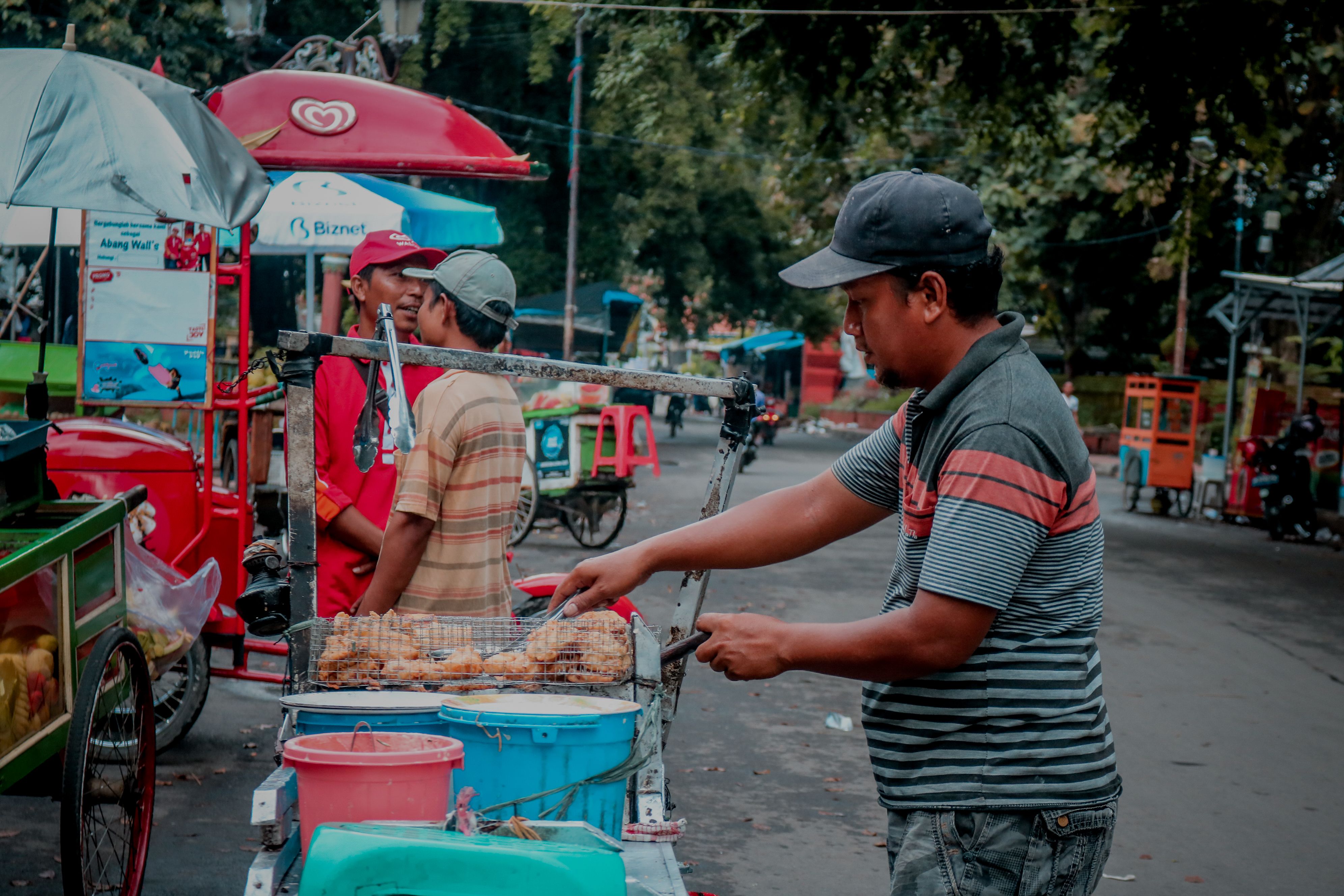 Street Food Vendor with His Cart · Free Stock Photo