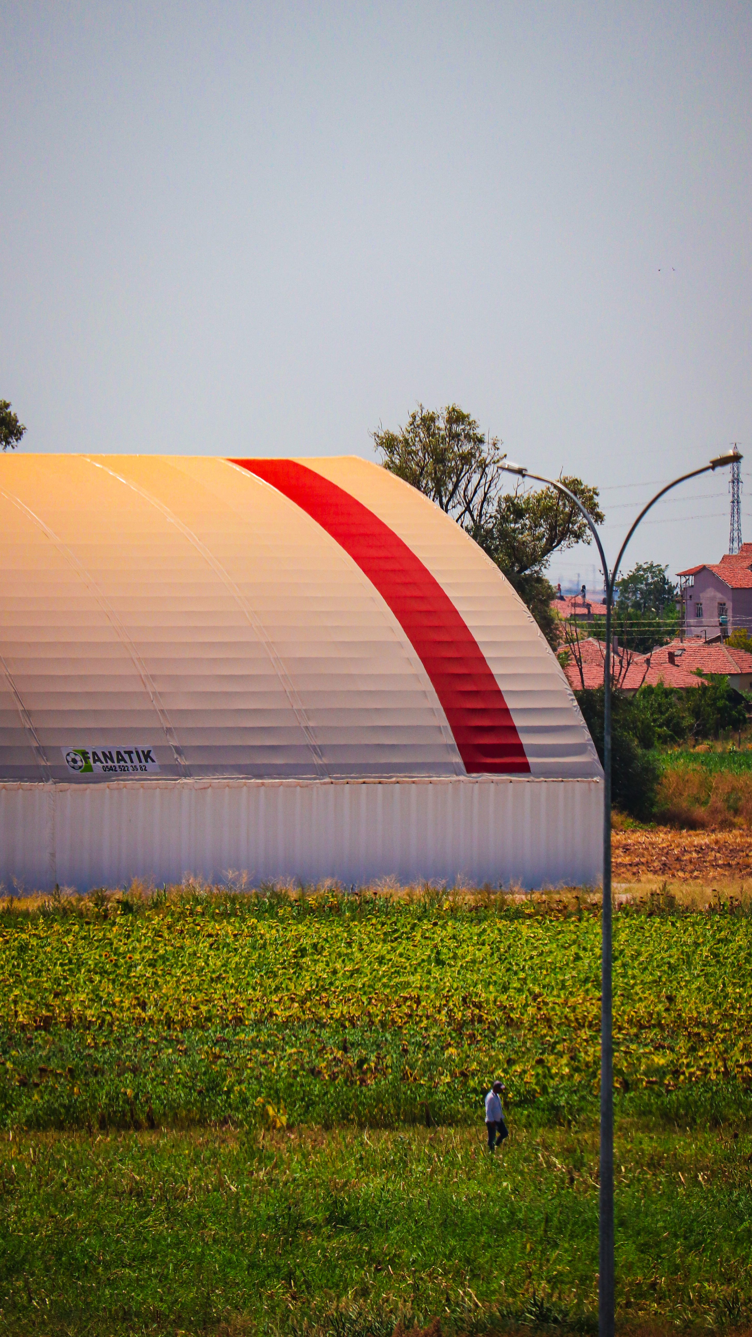A Cropland and a Farm Building · Free Stock Photo