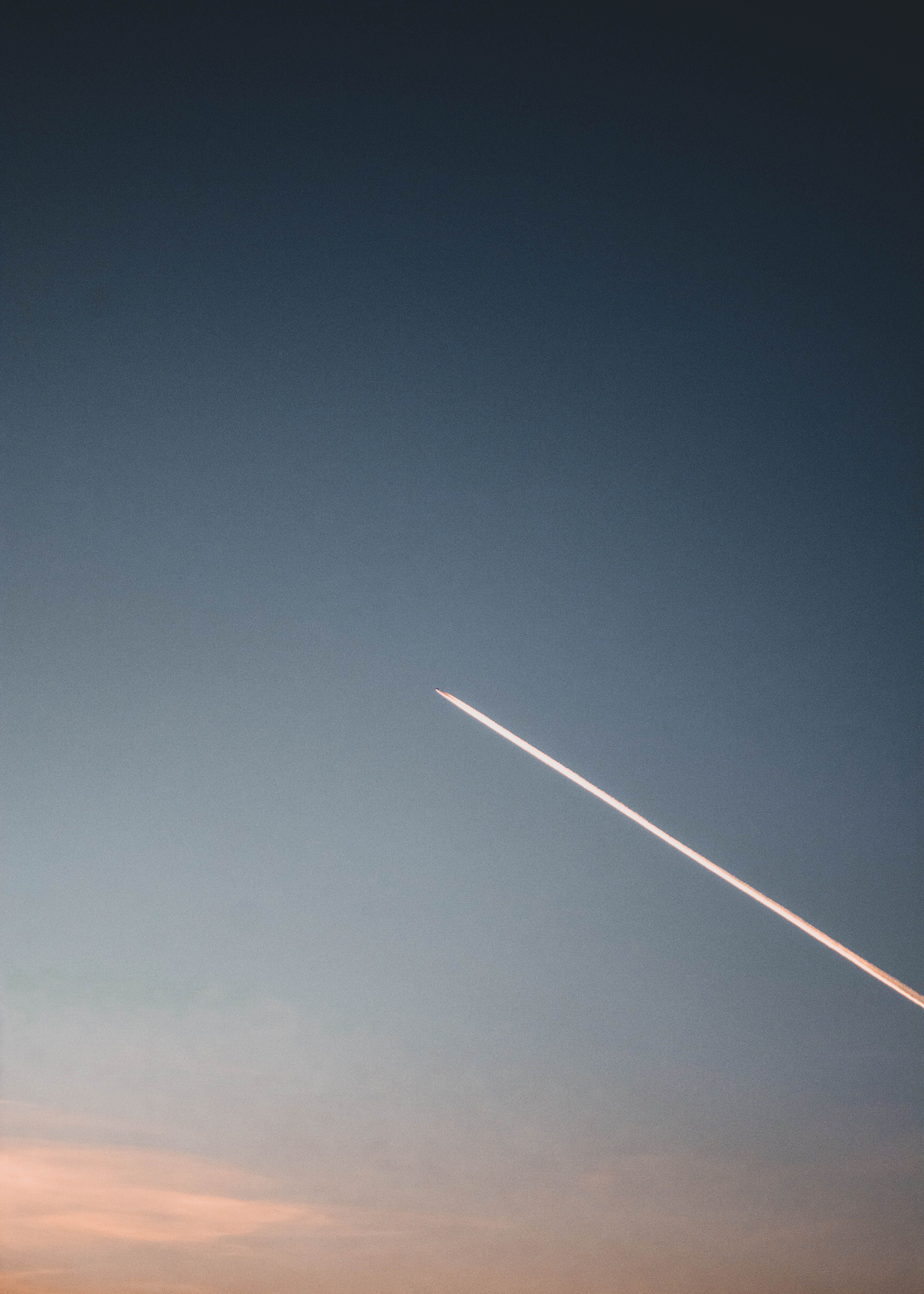 Streak of Smoke Behind a Flying Plane · Free Stock Photo