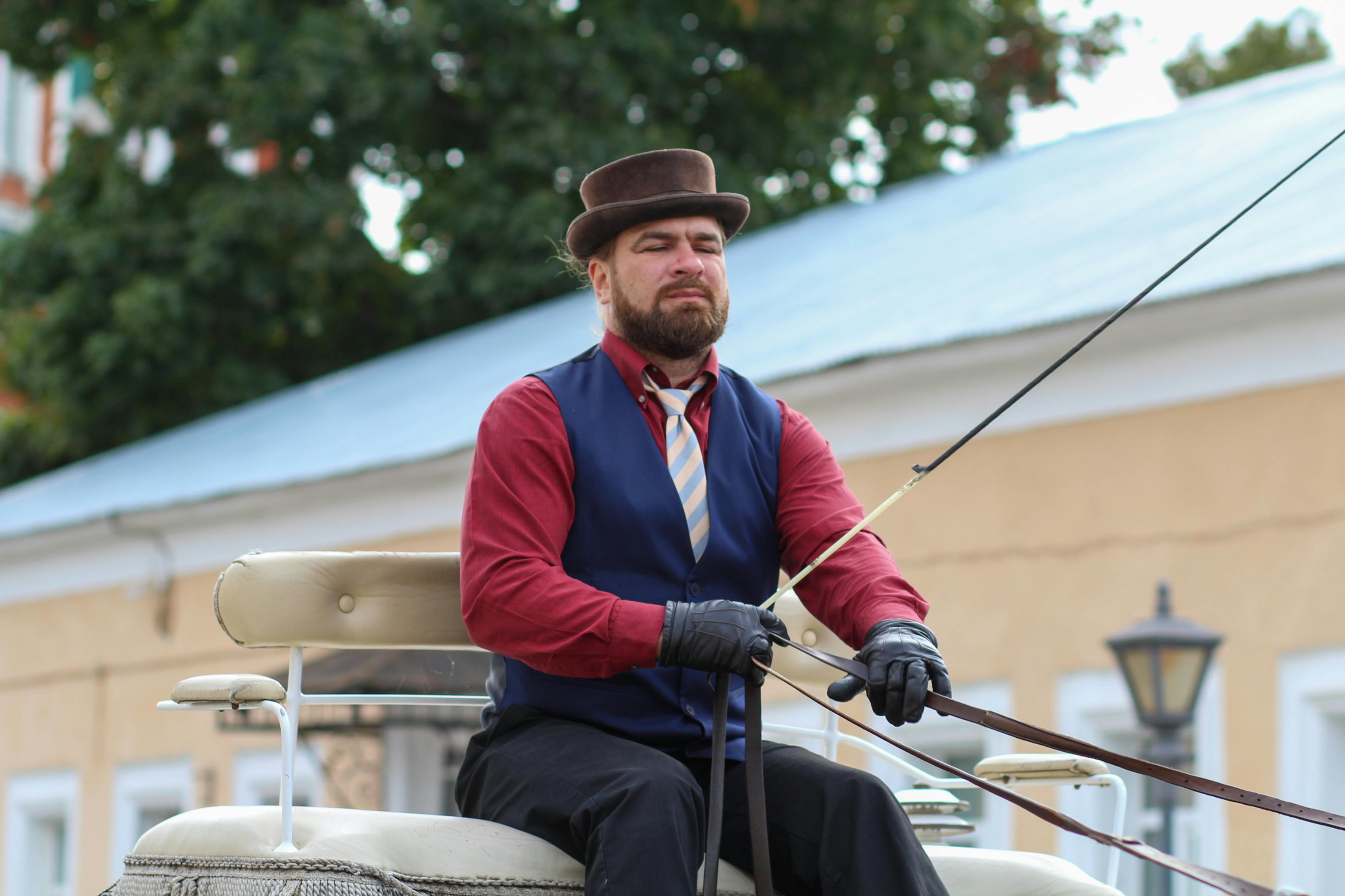Man Driving a Traditional Cab · Free Stock Photo