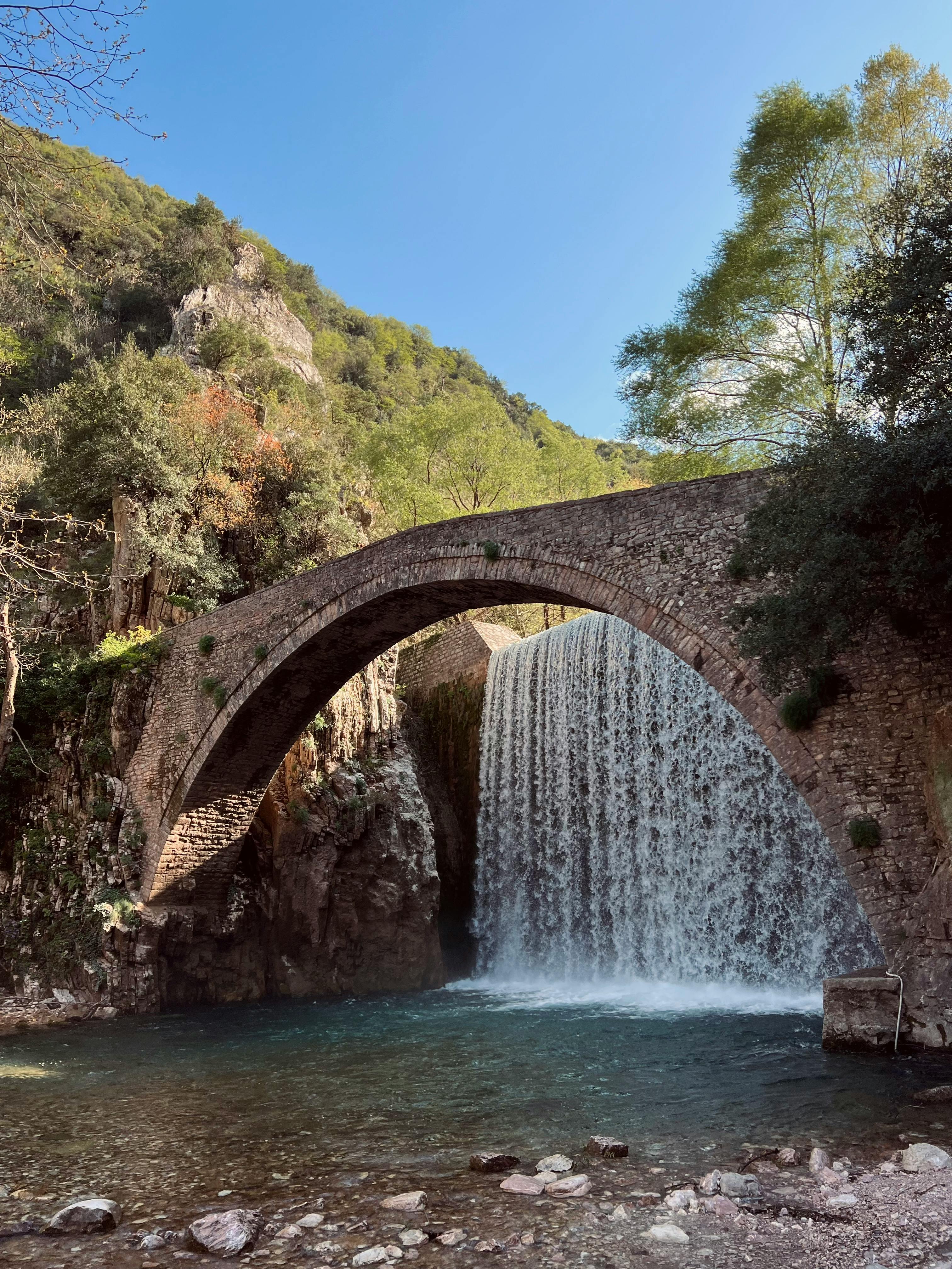 Stone Bridge Above a Waterfall · Free Stock Photo