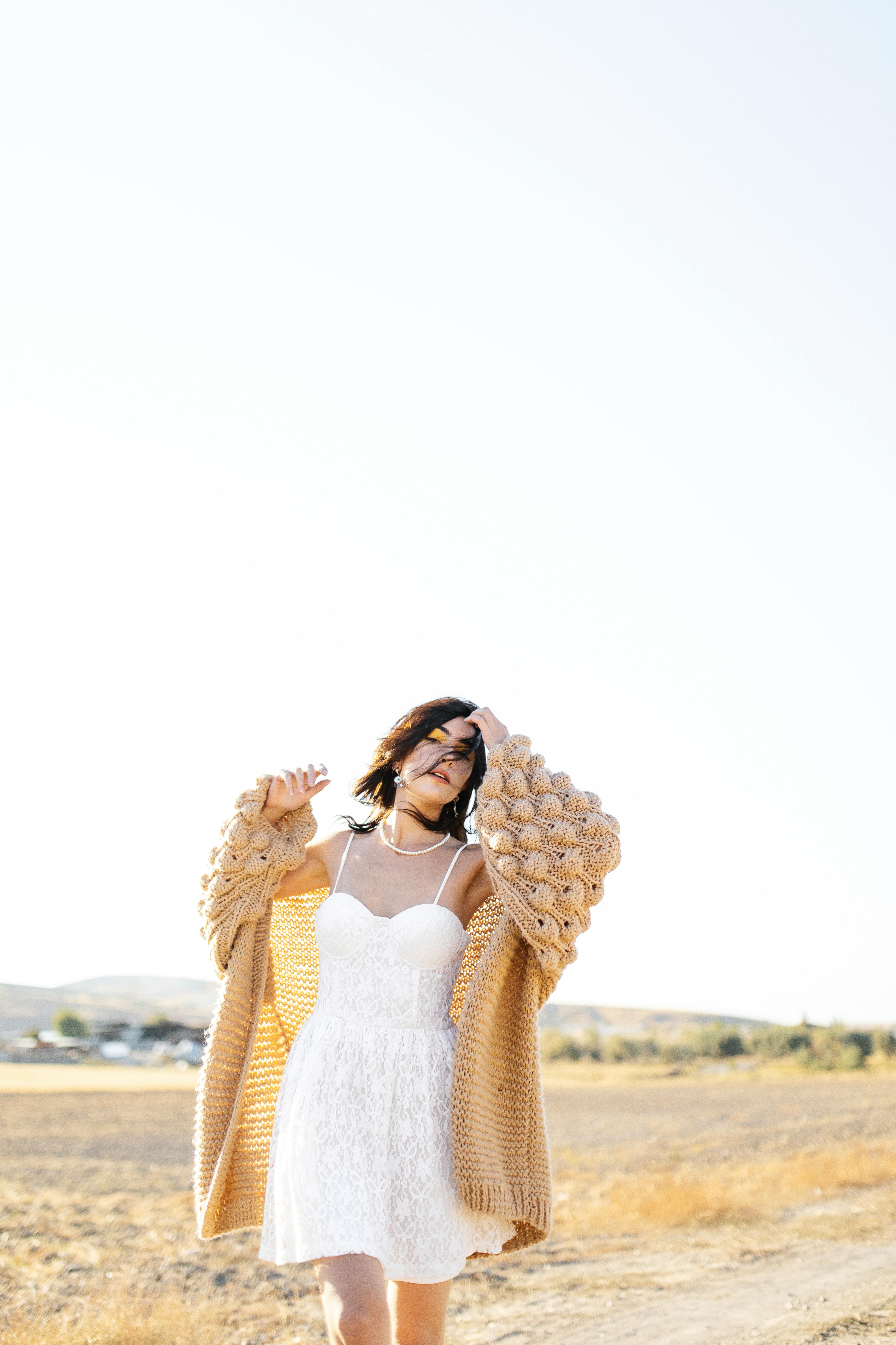 Model in a White Lace Sundress and a Long Beige Cardigan · Free Stock Photo