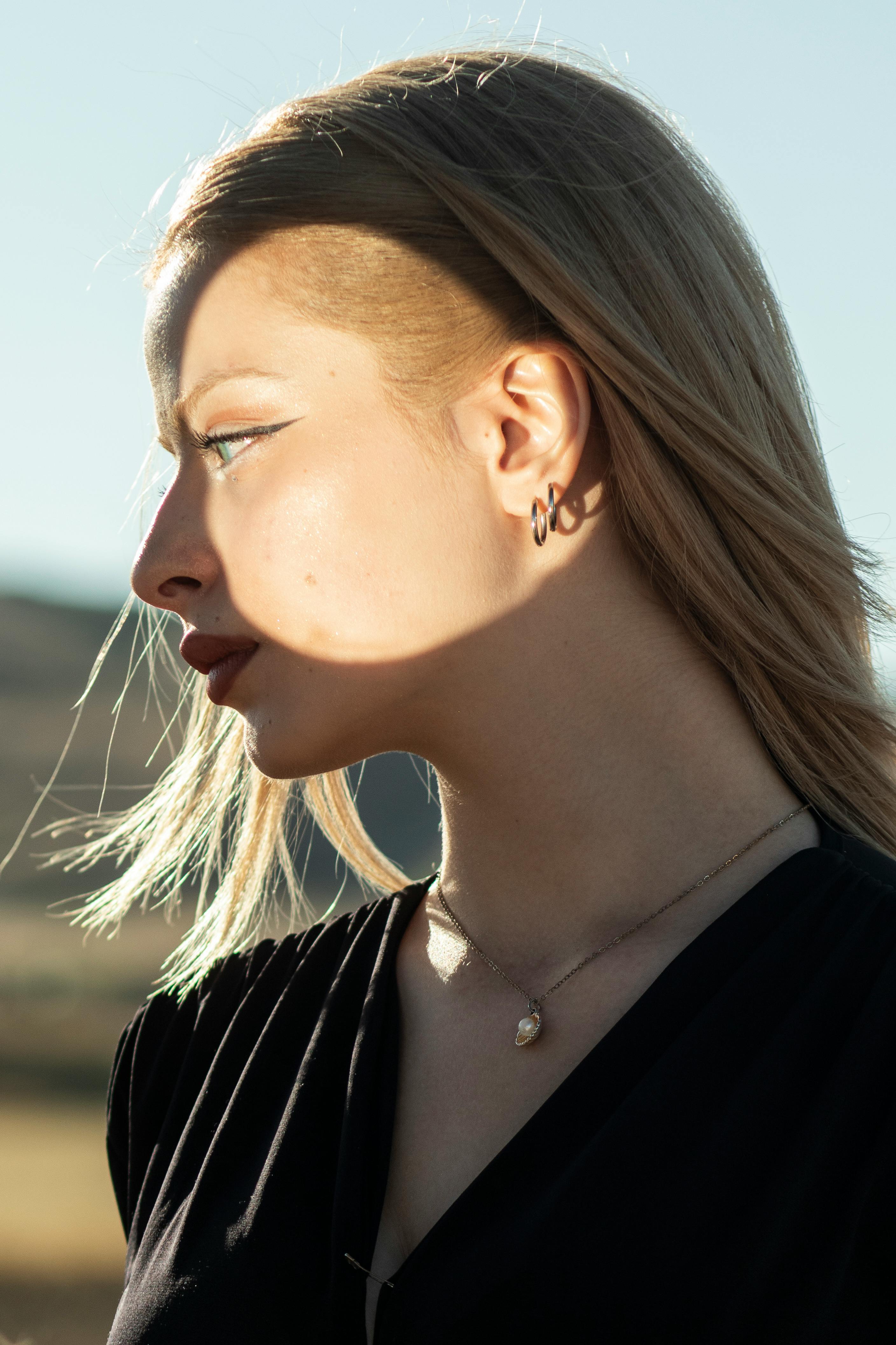 A Portrait of a Woman in Sunlight · Free Stock Photo