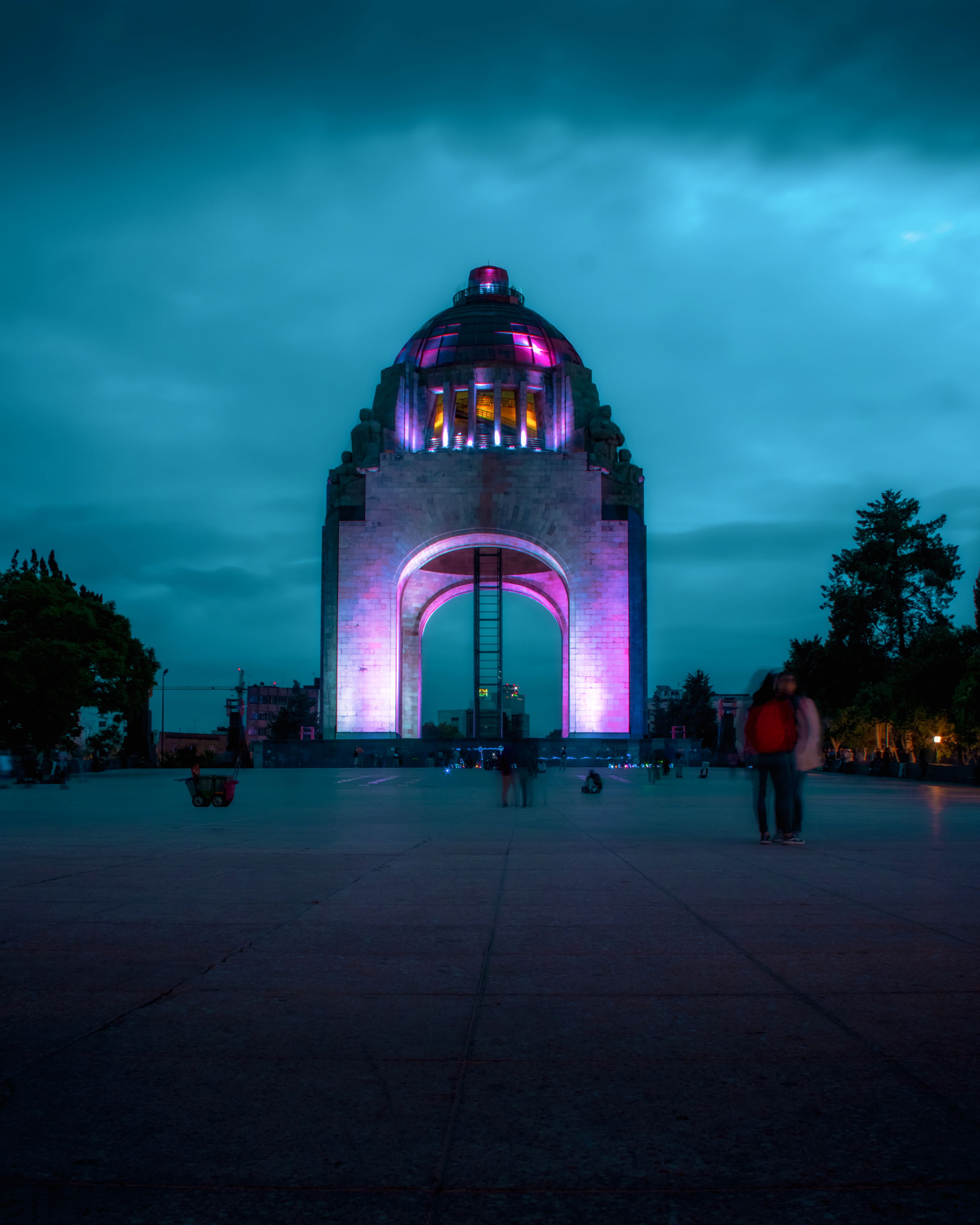 Illuminated Monument on a Town Square at Evening · Free Stock Photo