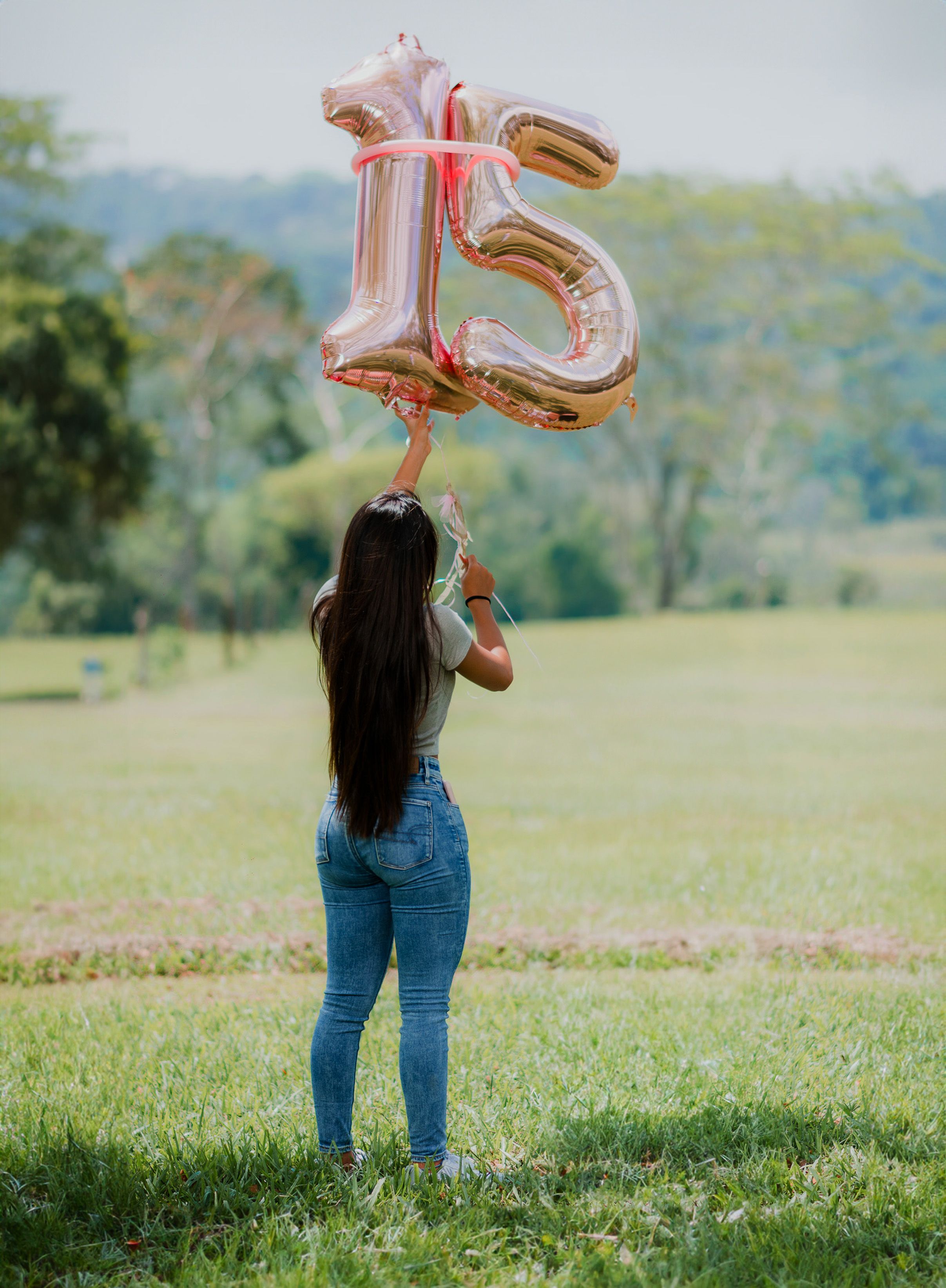 Back View of Brunette Girl with Birthday Balloons · Free Stock Photo