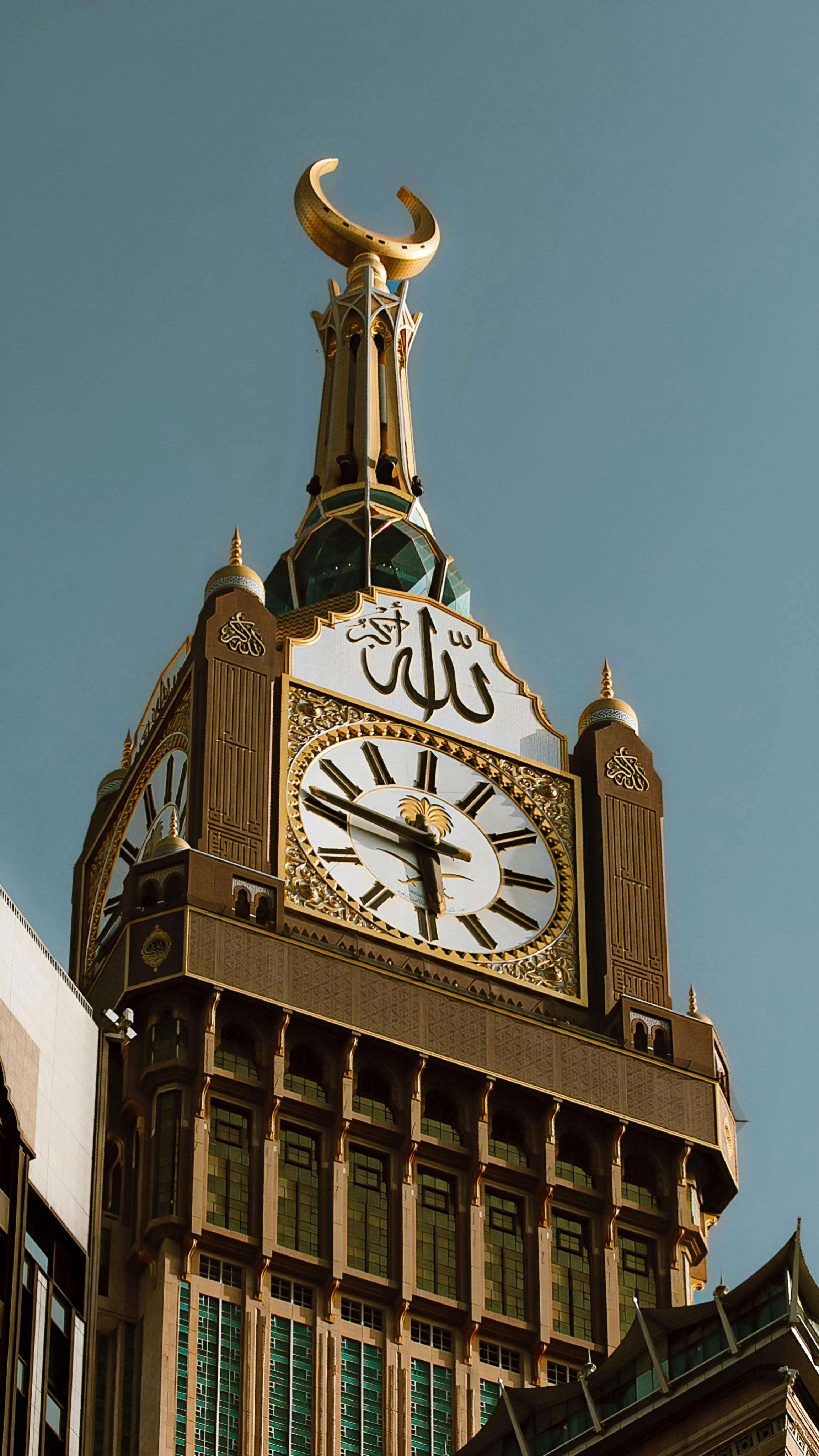 Low Angle Shot of the Mecca Clock Tower with Arabic Script · Free Stock ...