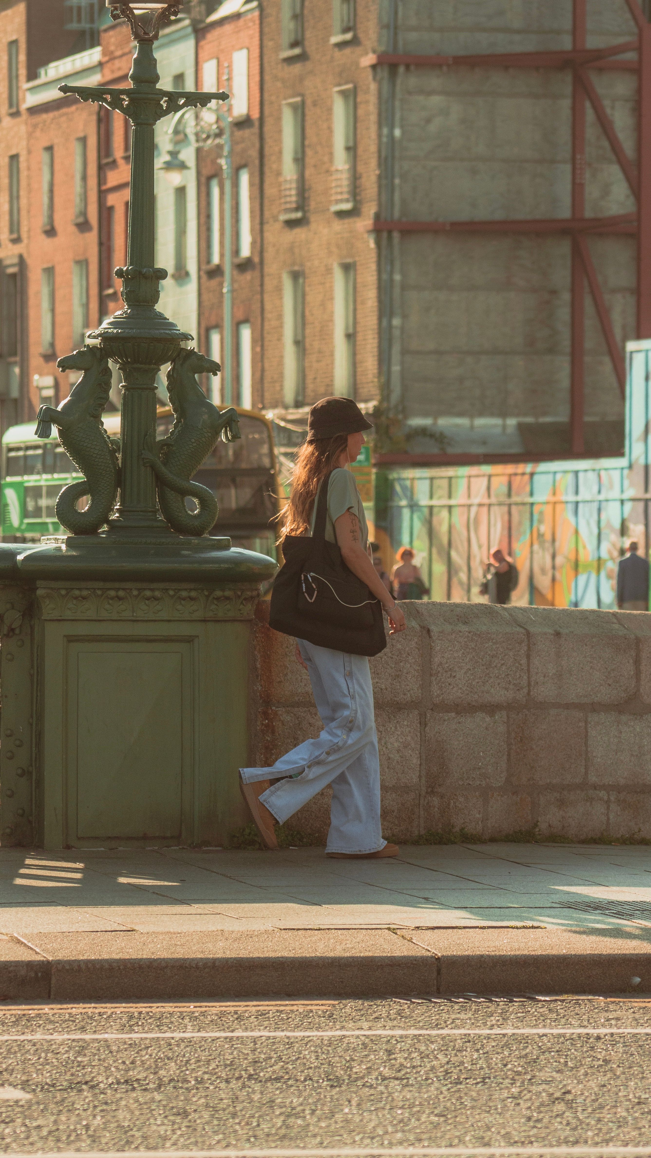 Candid Picture of a Woman Walking on the Pavement in City · Free Stock ...