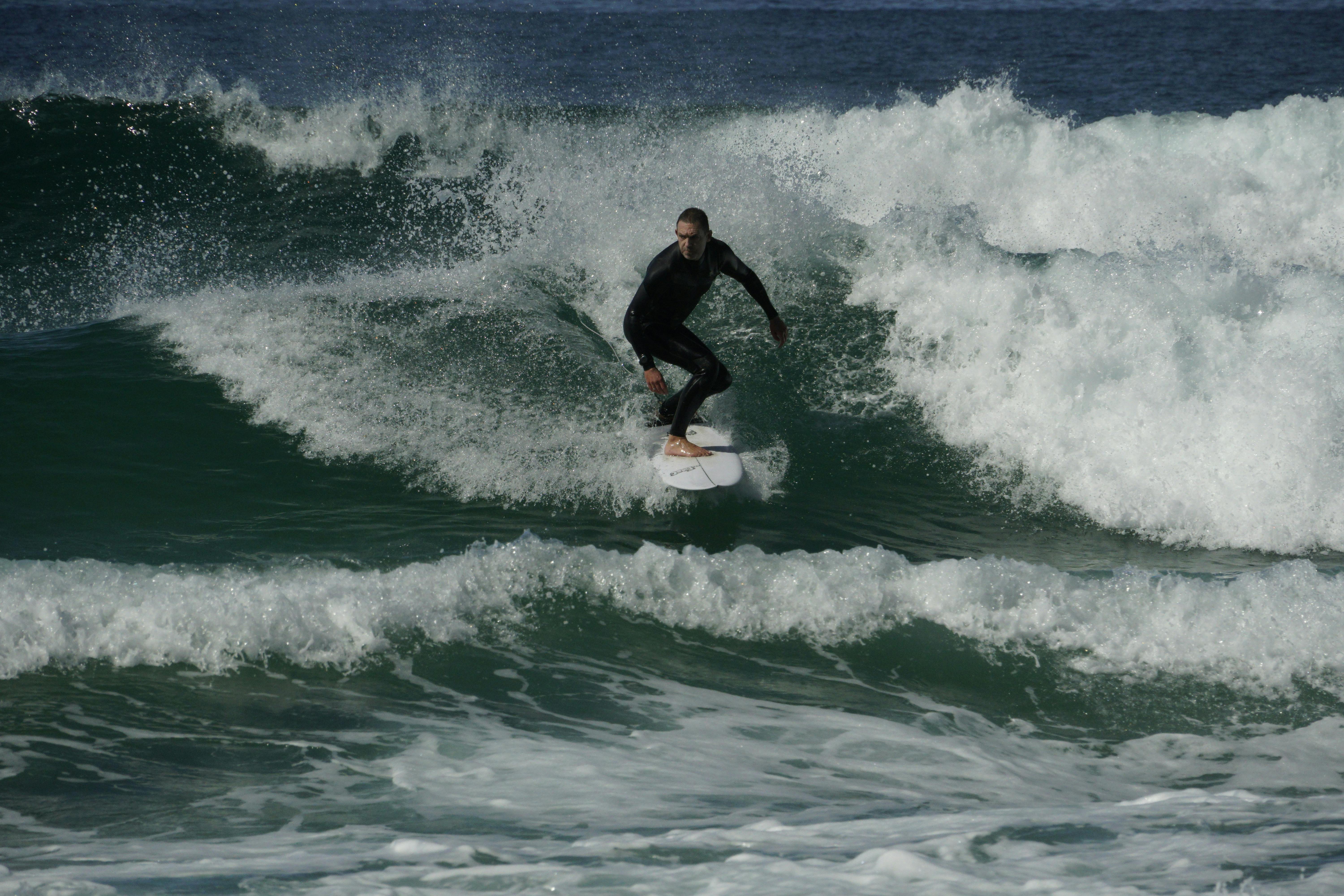 Surfer on Waves · Free Stock Photo