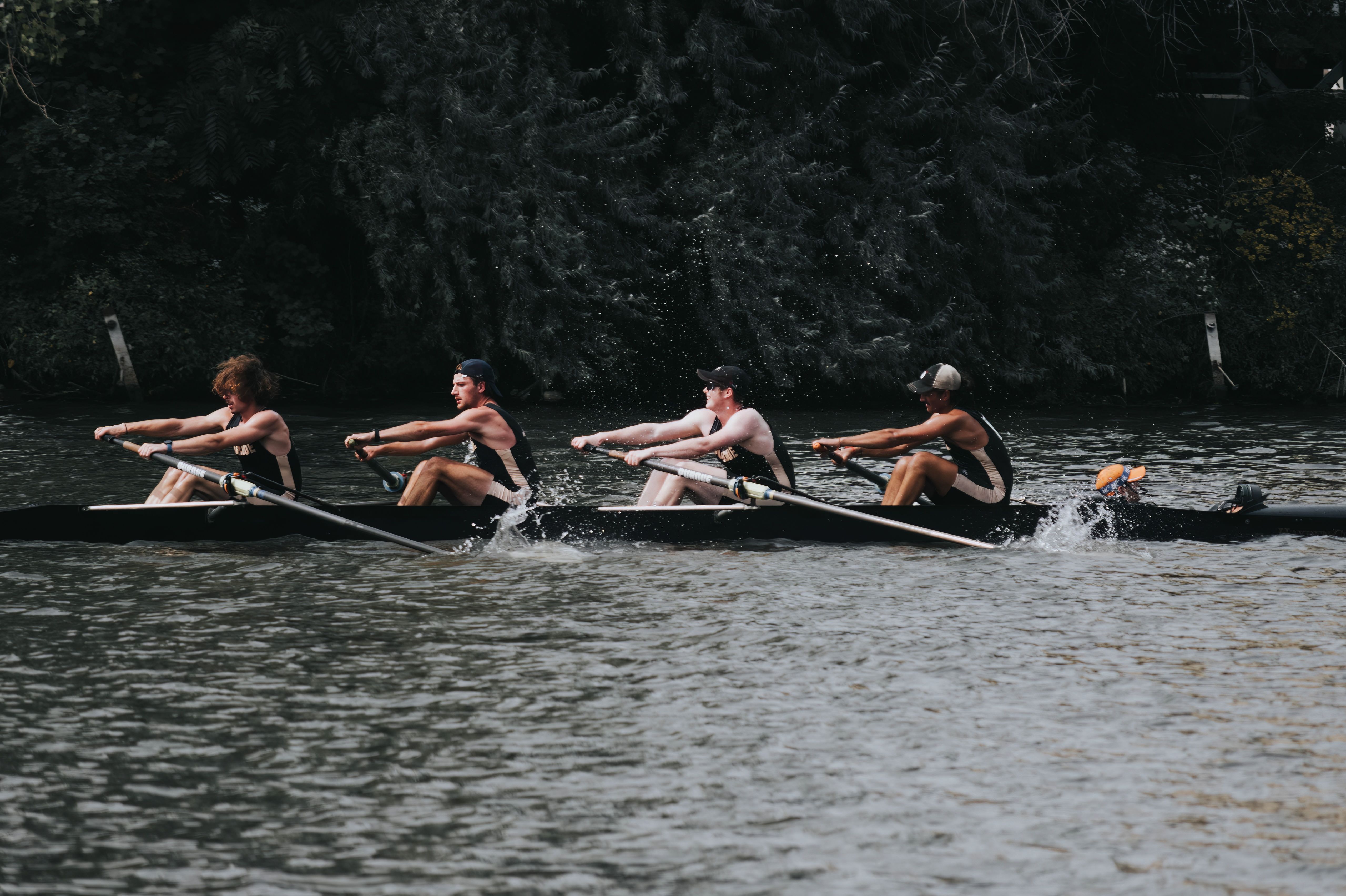 Men Rowing on Canoe on Water · Free Stock Photo