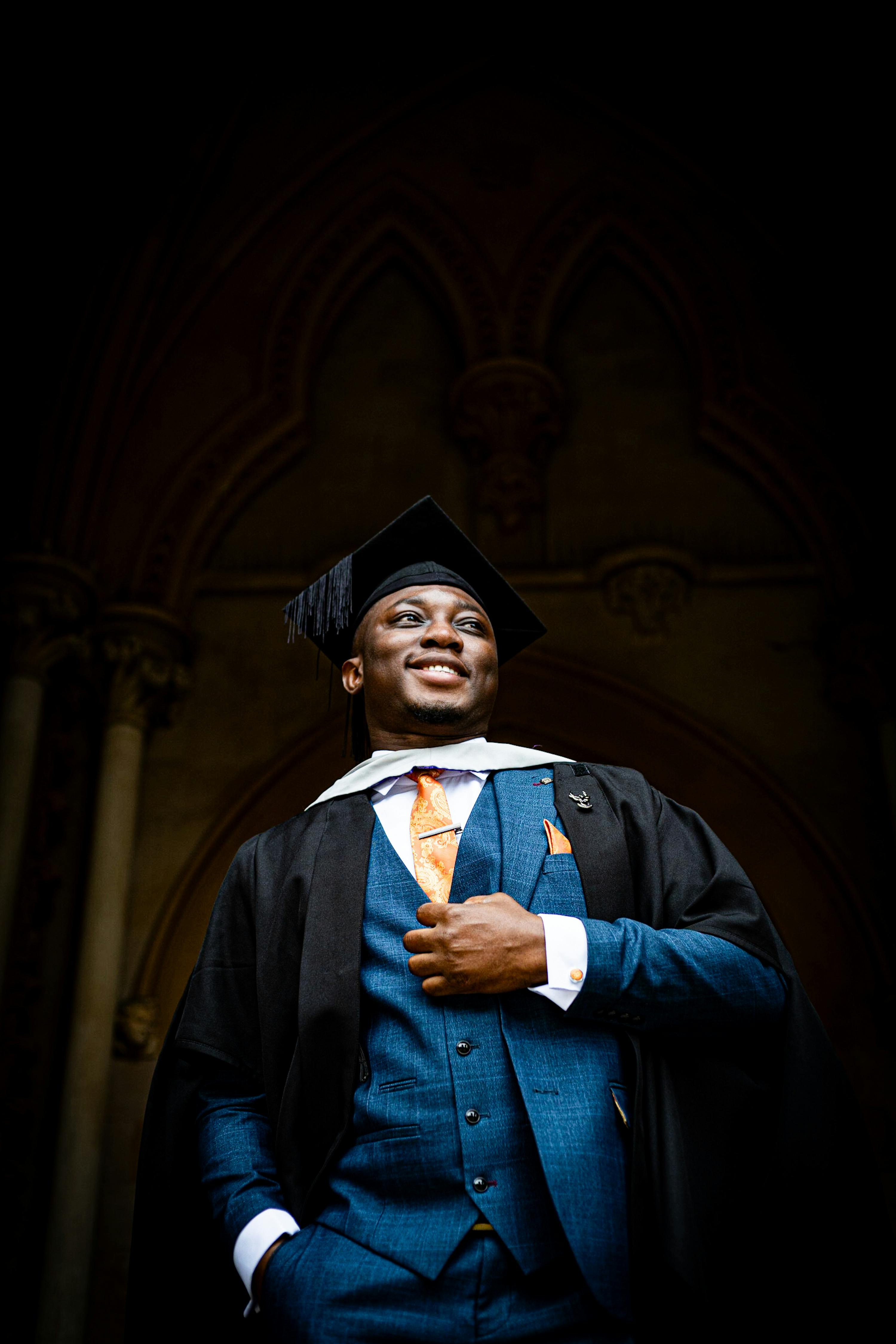 Graduate in Academic Regalia and Blue Suit · Free Stock Photo