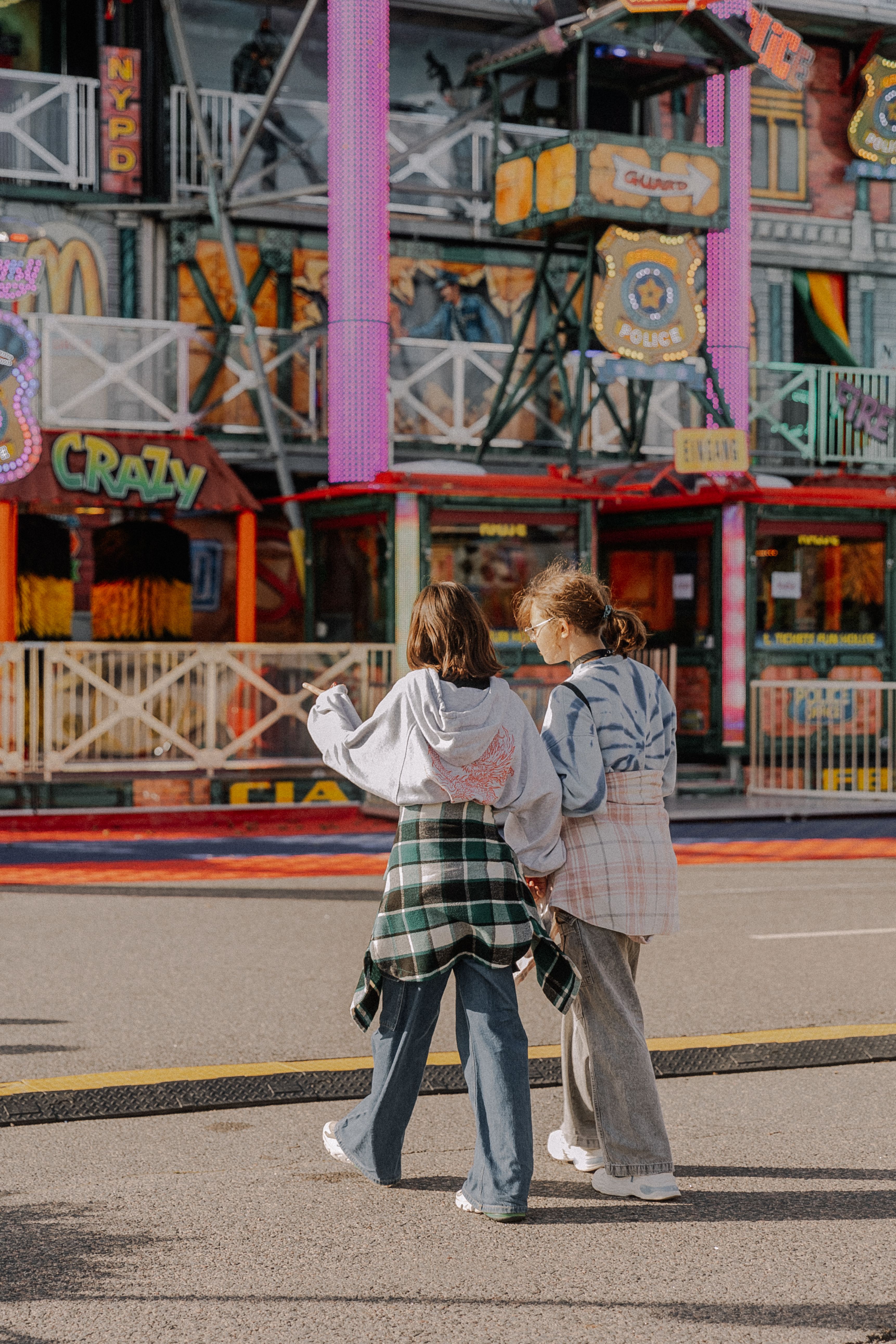 Girls Walking on the Street at a Fairground · Free Stock Photo